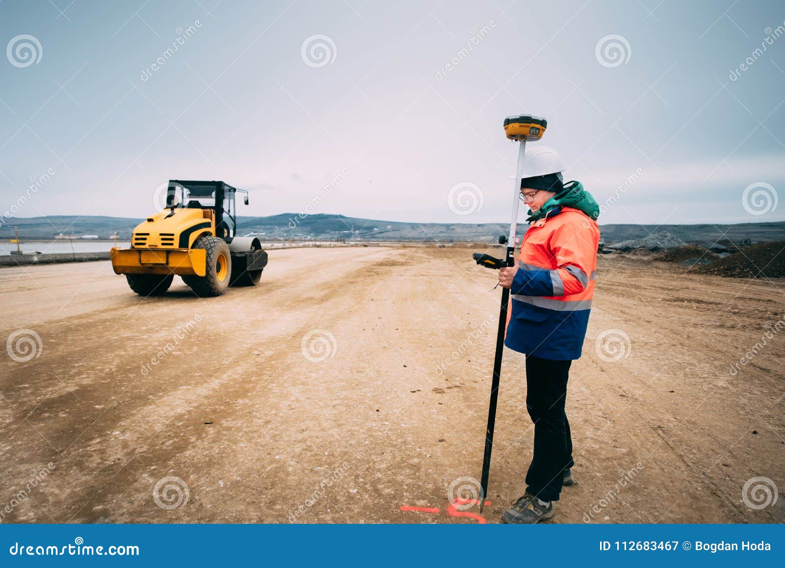 Portrait of Engineer on Construction Site, Surveyor Using Gps System ...