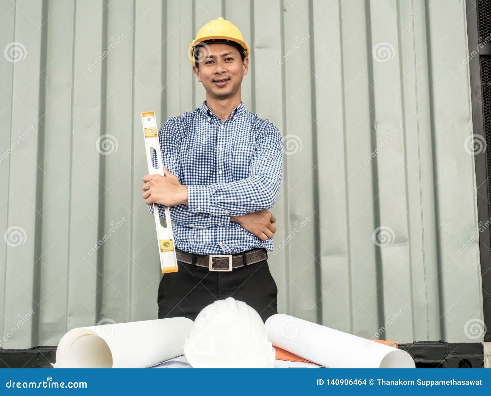 Portrait of an Engineer Man Holding Level Measuring Instrument and ...