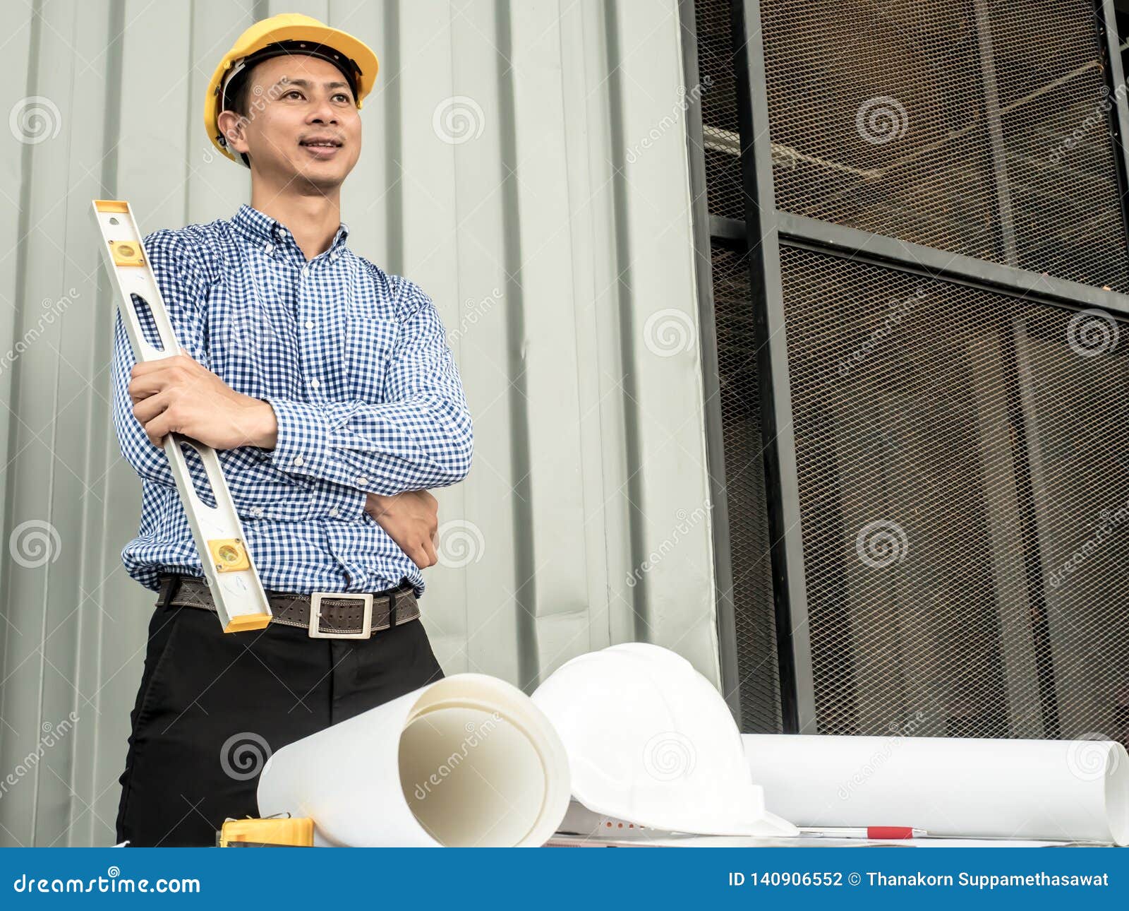 Portrait of an Engineer Man Holding Level Measuring Instrument and ...