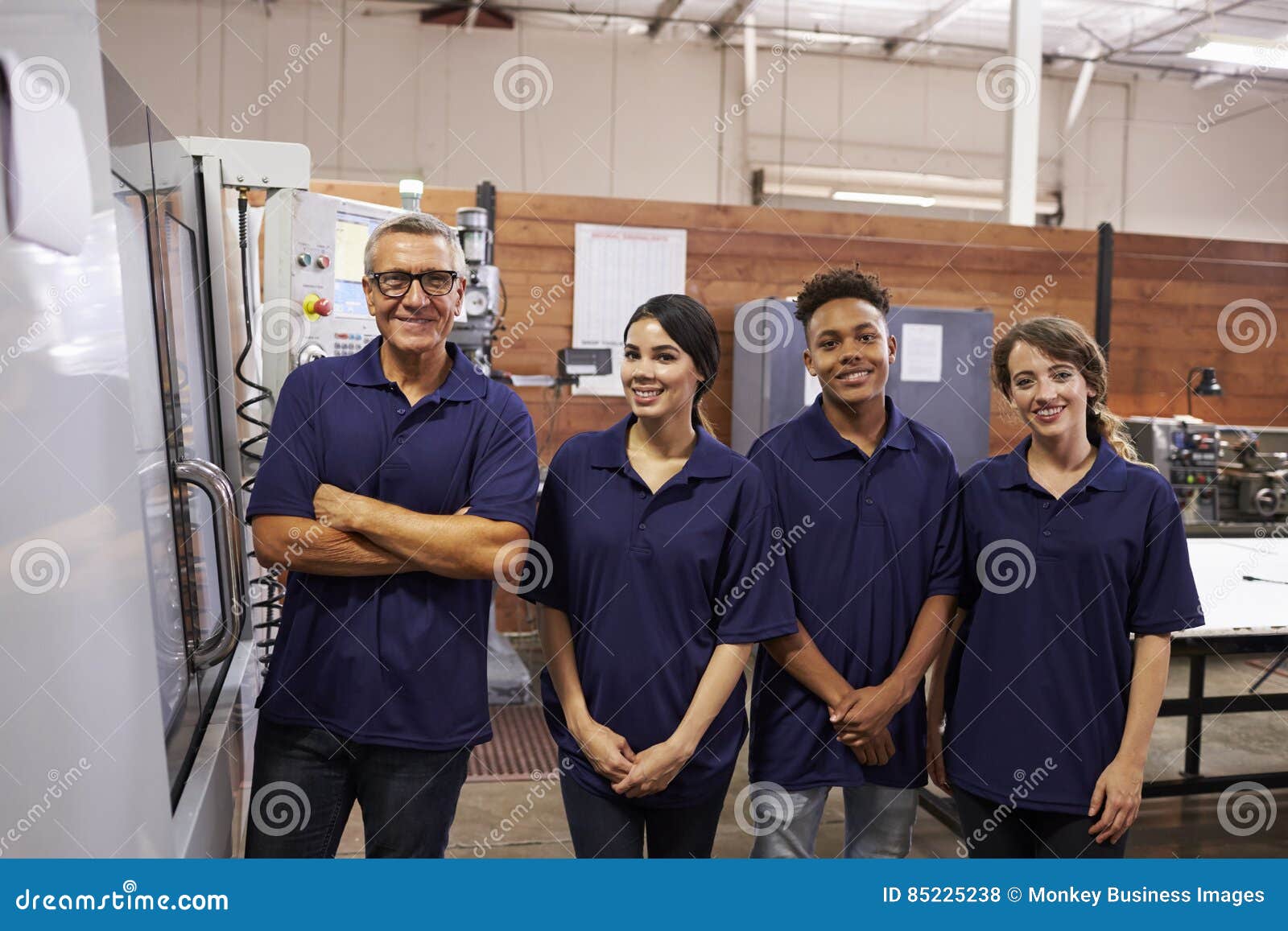 Portrait of Engineer Training Apprentices on CNC Machine Stock Photo ...