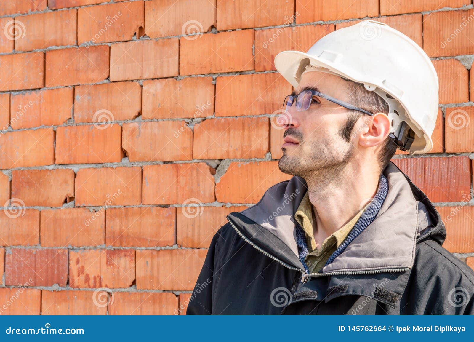 Portrait of an Engineer Wearing Hardhat at the Construction Site Stock ...