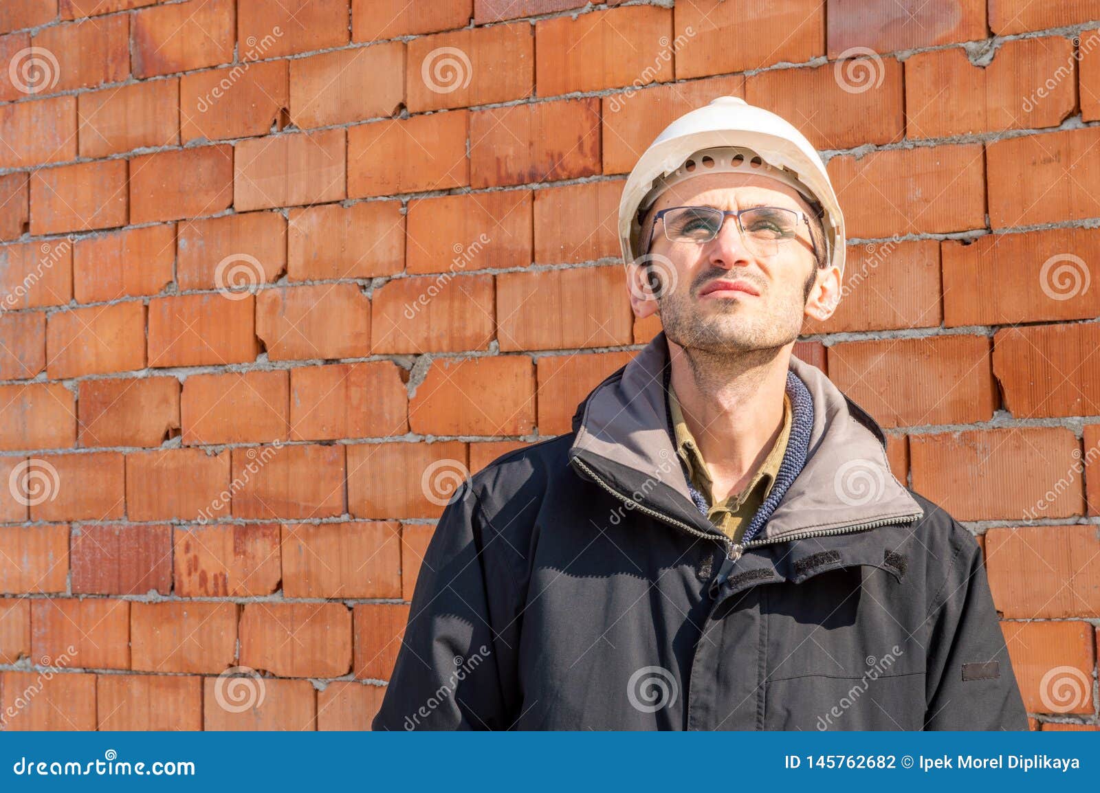 Portrait of an Engineer Wearing Hardhat at the Construction Site Stock ...