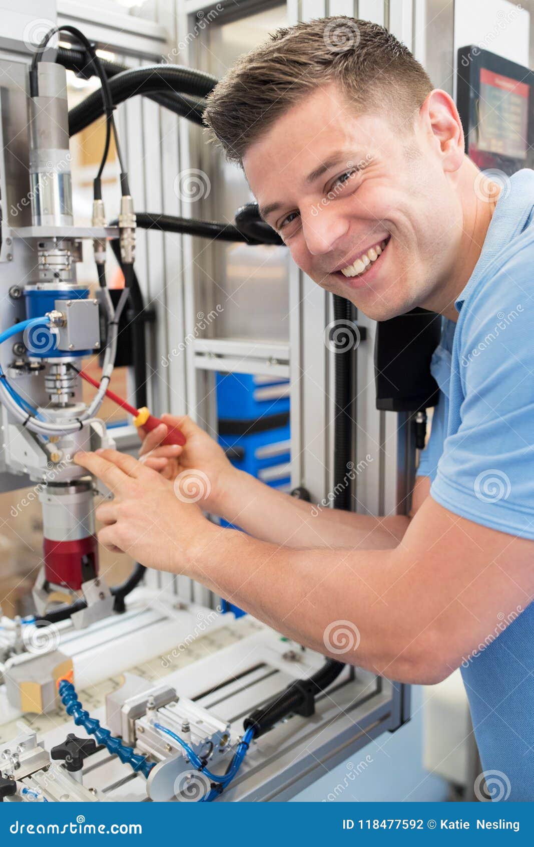 Portrait of Male Engineer Working on Machine in Factory Stock Photo ...