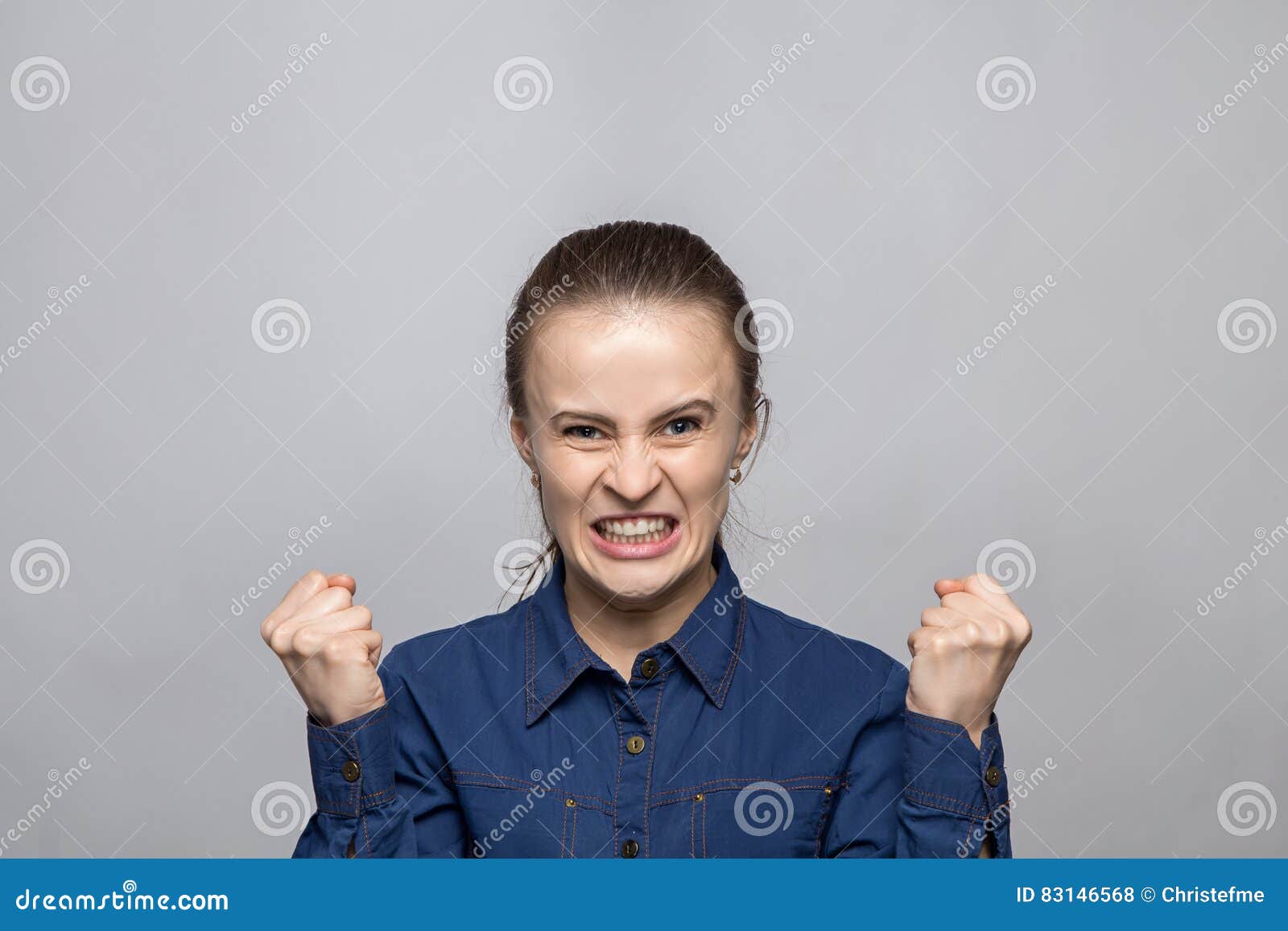 Portrait Of Enraged Furious Teen Female In Hoodie Standing With ...
