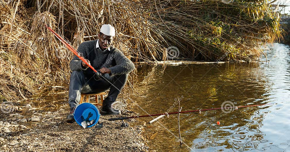 Man Pulling Fish with Rods on River Stock Photo - Image of relaxation ...