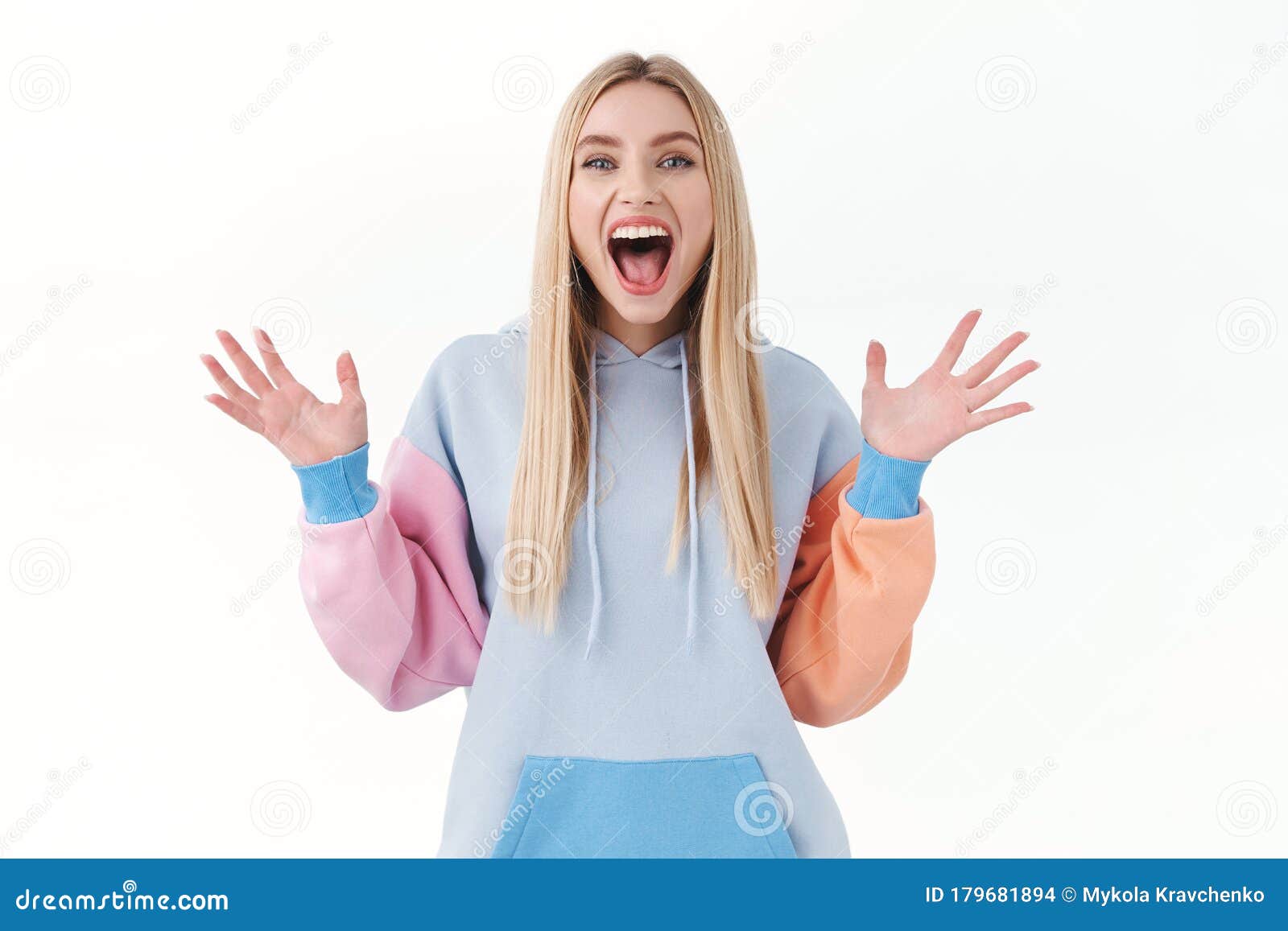 Portrait Of Enthusiastic Good Looking Blonde Girl Telling Big News