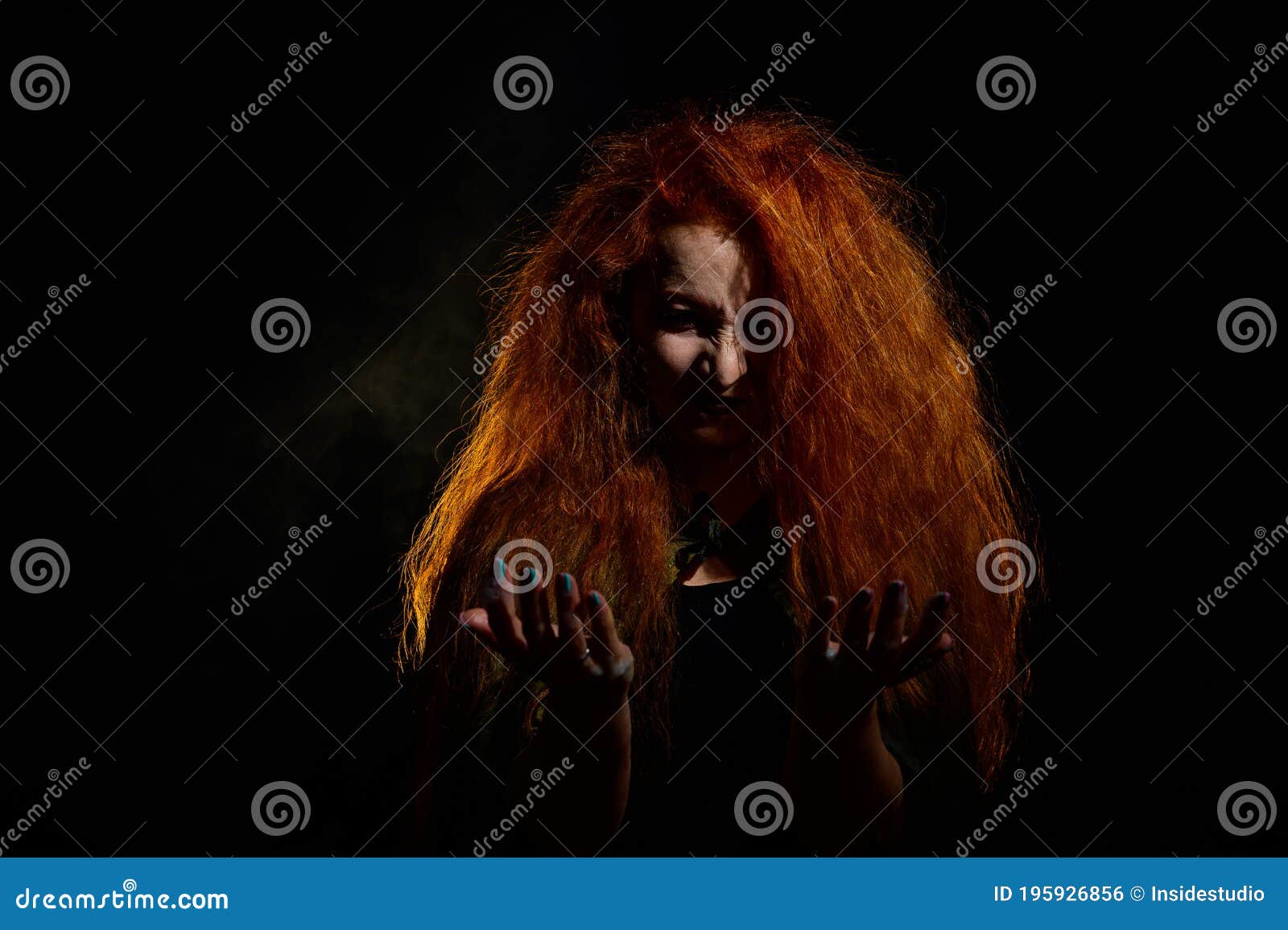 Portrait of an Evil Red-haired Witch Conjures in the Dark. Stock Photo ...