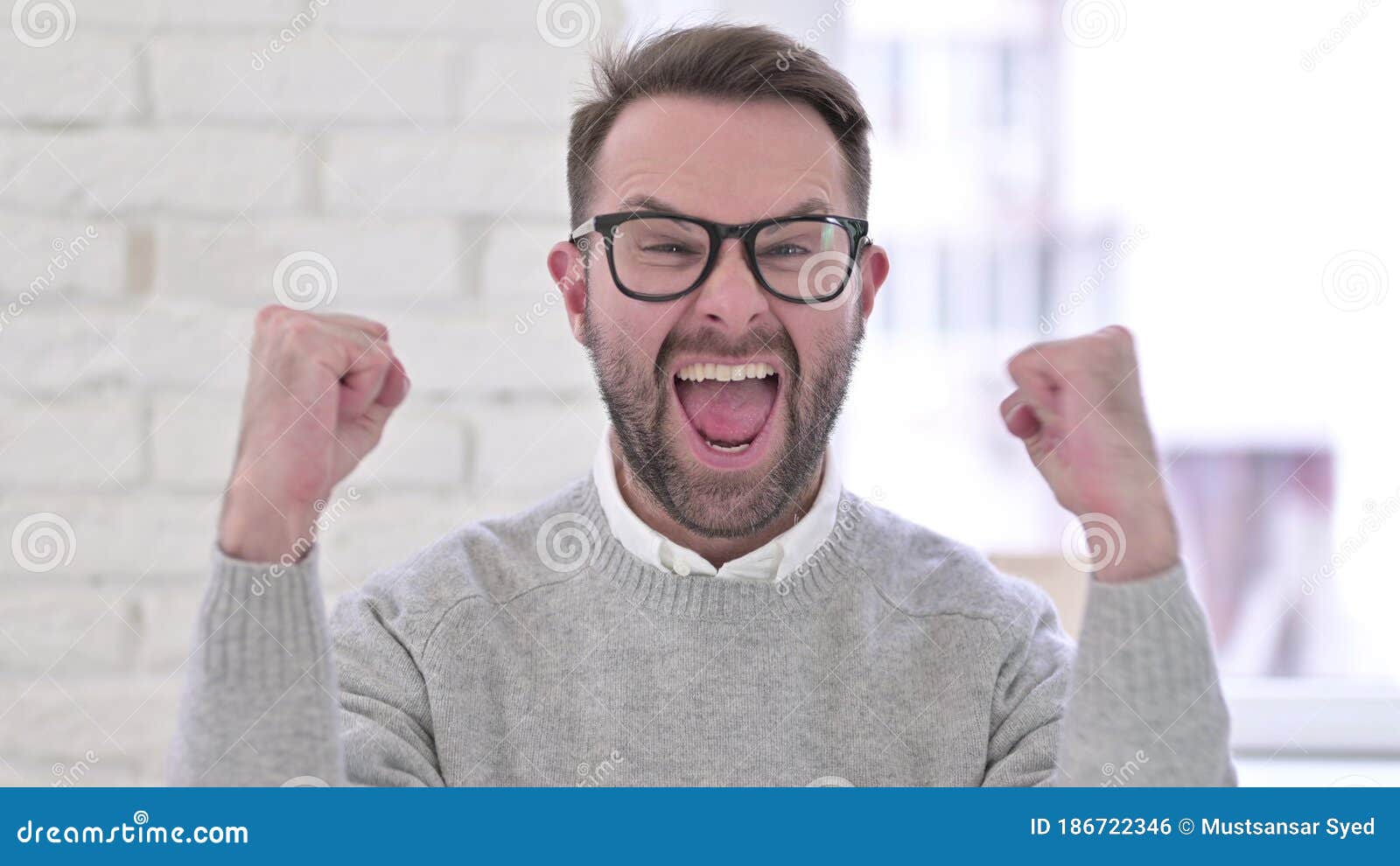 Portrait of Excited Creative Man Celebrating Success Stock Photo ...