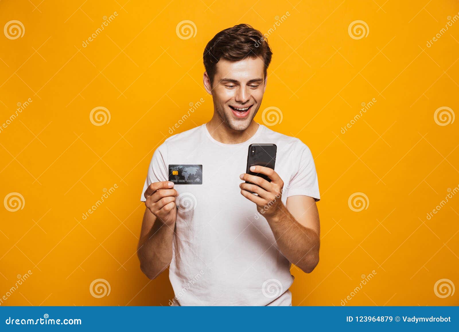 Portrait of an Excited Young Man Holding Mobile Phone Stock Image ... Portrait of an Excited Young Man Holding Mobile Phone Stock Image ...