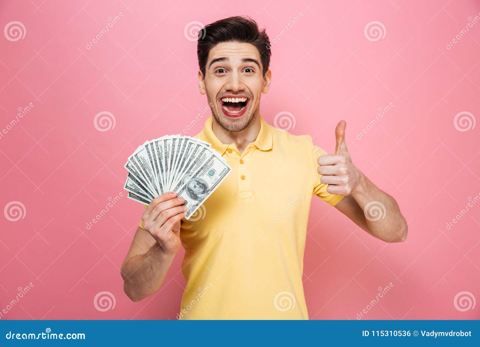 Portrait Of An Excited Young Man Holding Money Banknotes Stock Photo ... Portrait Of An Excited Young Man Holding Money Banknotes Stock Photo ...