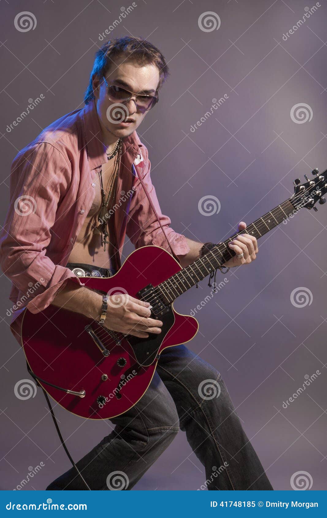 Portrait of Expressive Man Playing the Guitar with Passion Stock Image ...