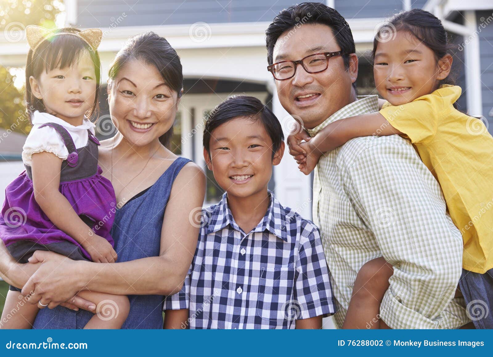 Portrait of Family Standing Outside House Stock Photo - Image of person ...