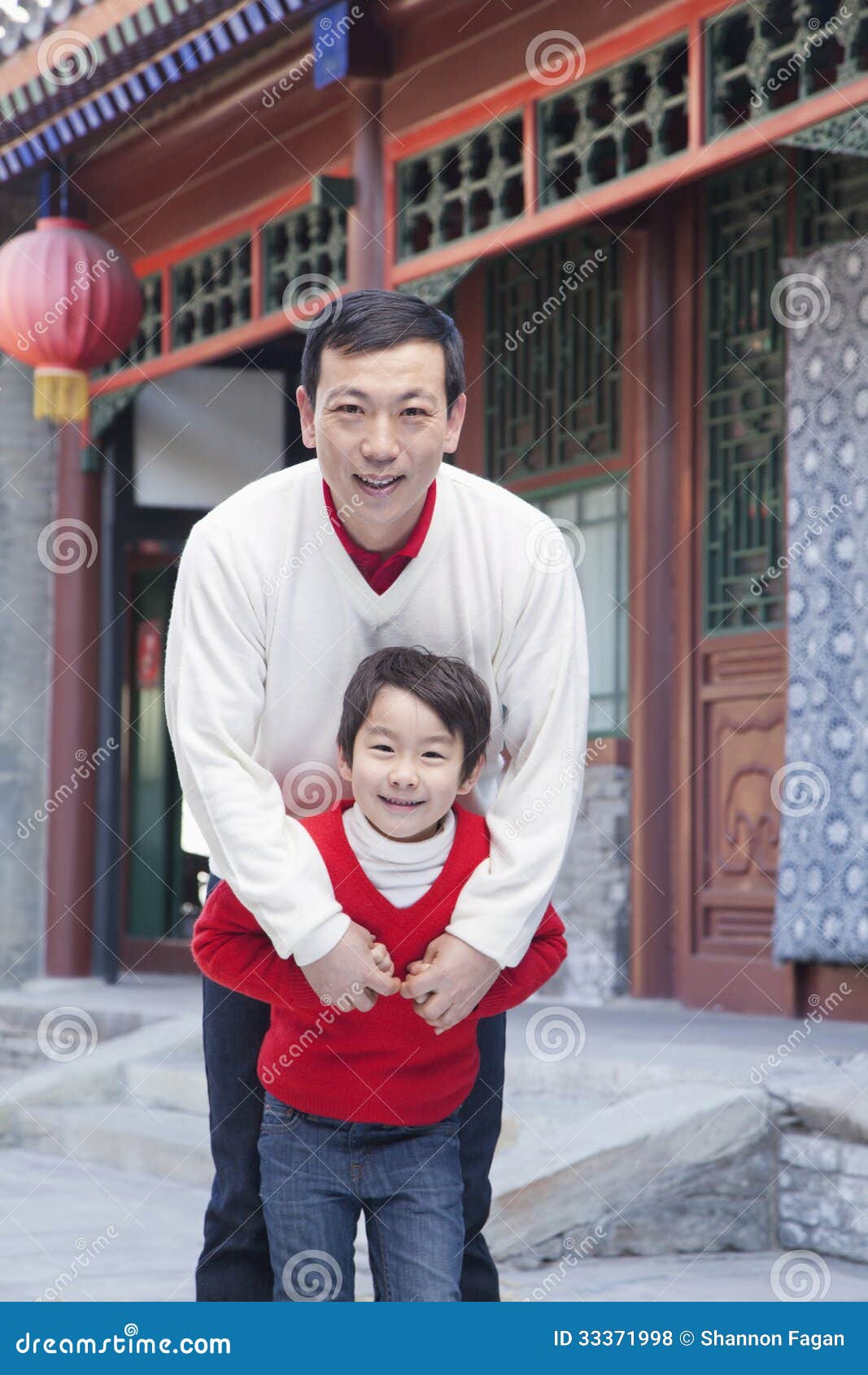 Portrait of Father and Son by a Tradition Chinese Building Stock Photo ...