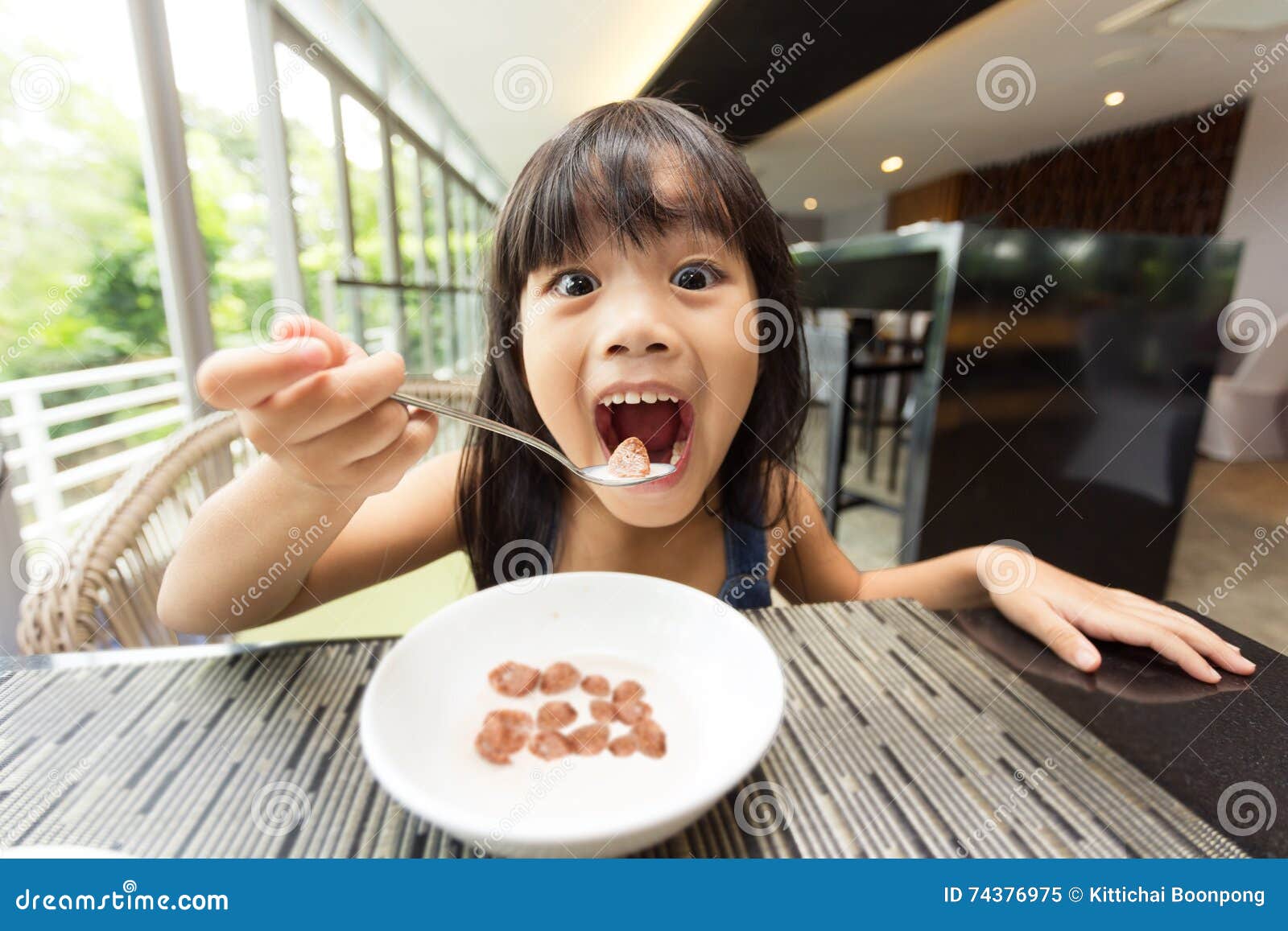 Portrait of Feeling Happy a Young Girl Having Breakfast on Table Stock ...
