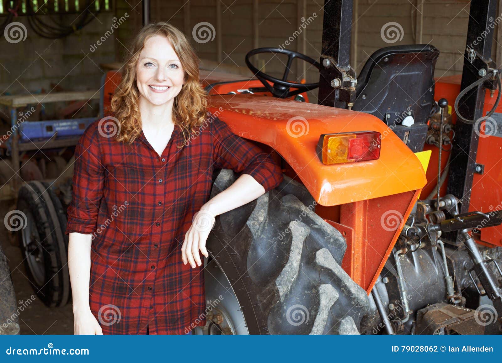Portrait of Female Agricultural Worker with Tractor Stock Photo - Image ...
