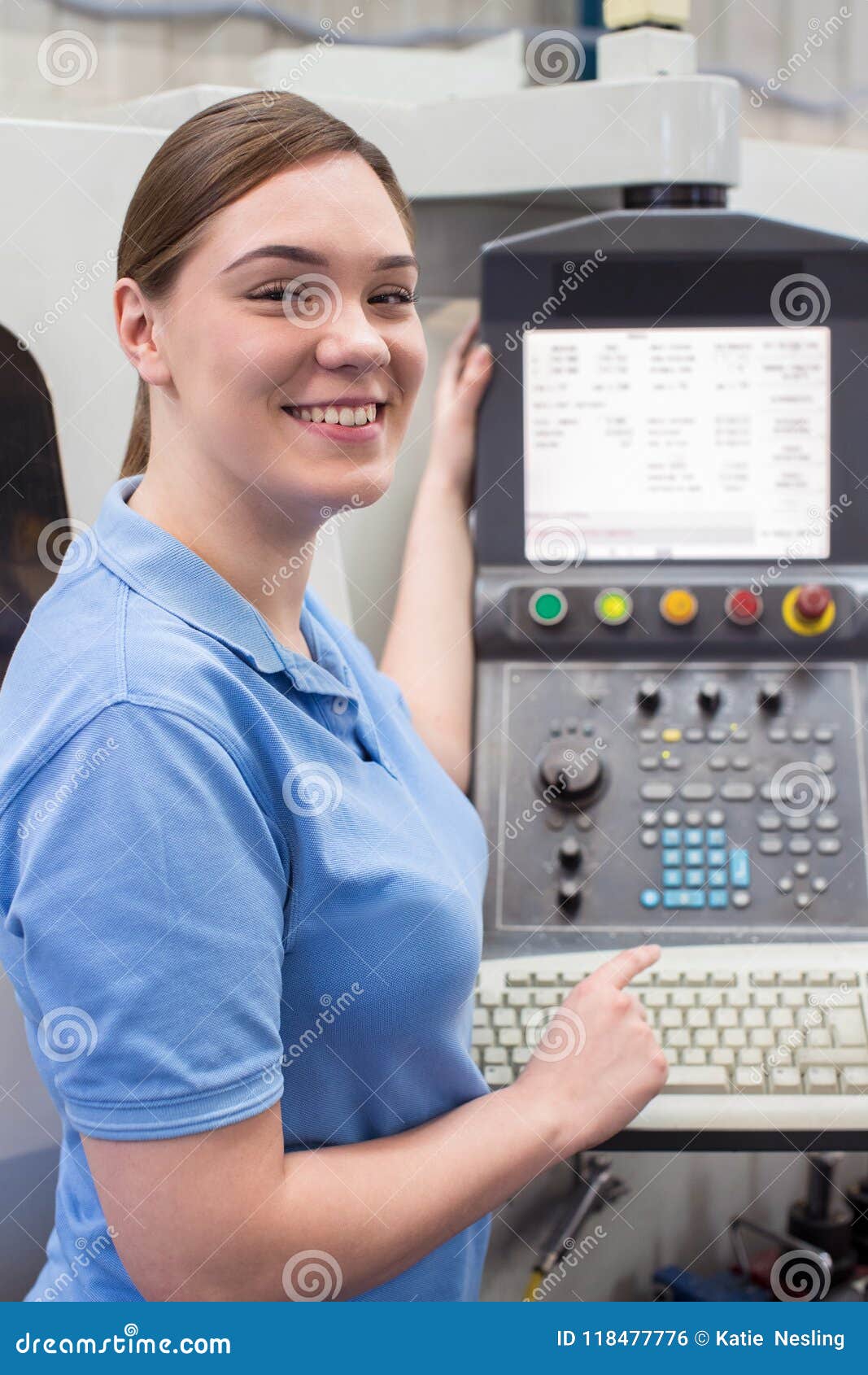 Portrait of Female Apprentice Engineer Operating CNC Machine in Stock ... Portrait of Female Apprentice Engineer Operating CNC Machine in Stock ...