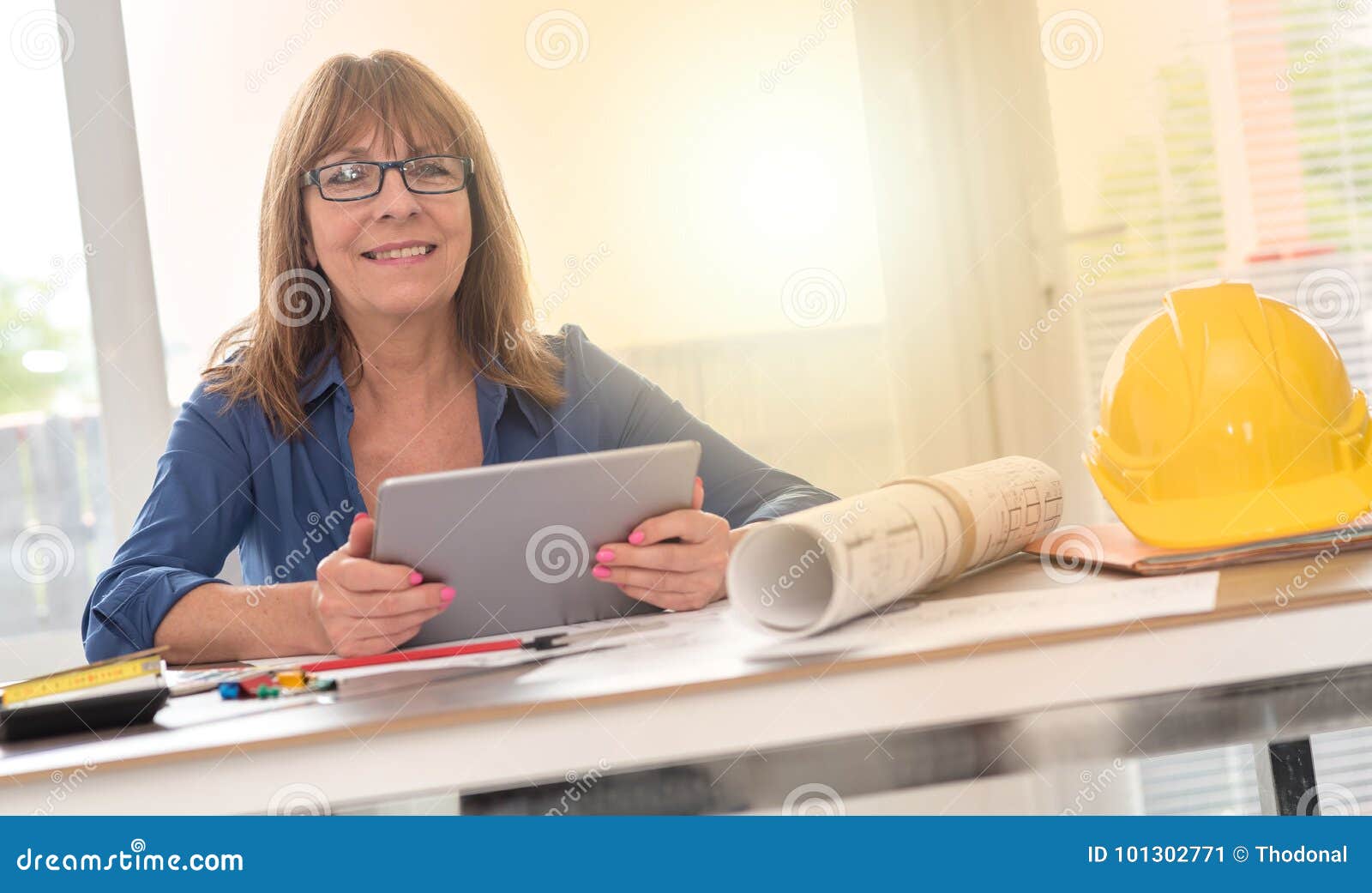 Portrait of Female Architect Working on Plans, Light Effect Stock Image ...