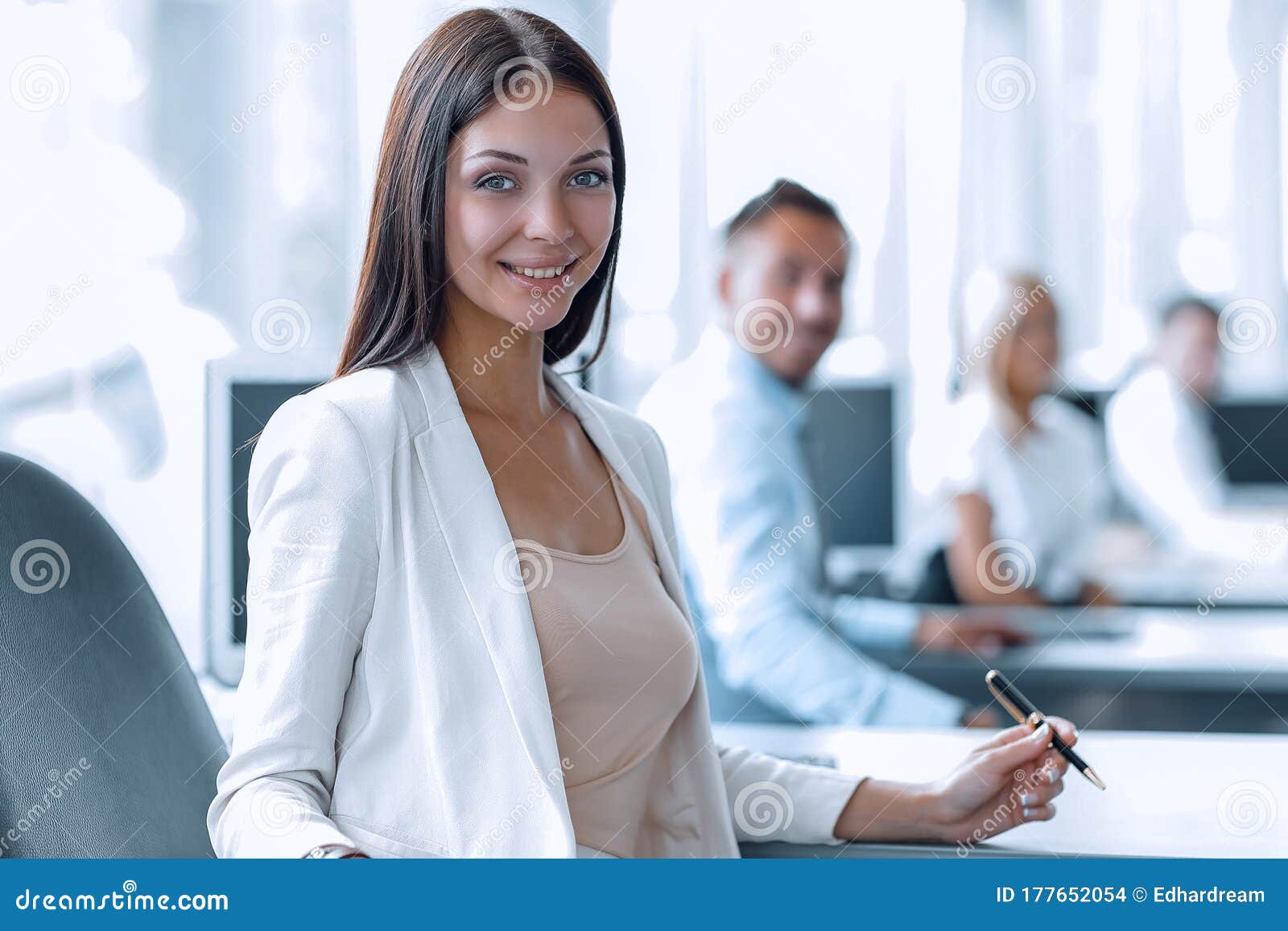 Portrait of a Female Assistant Sitting at a Desk Stock Photo - Image of ...