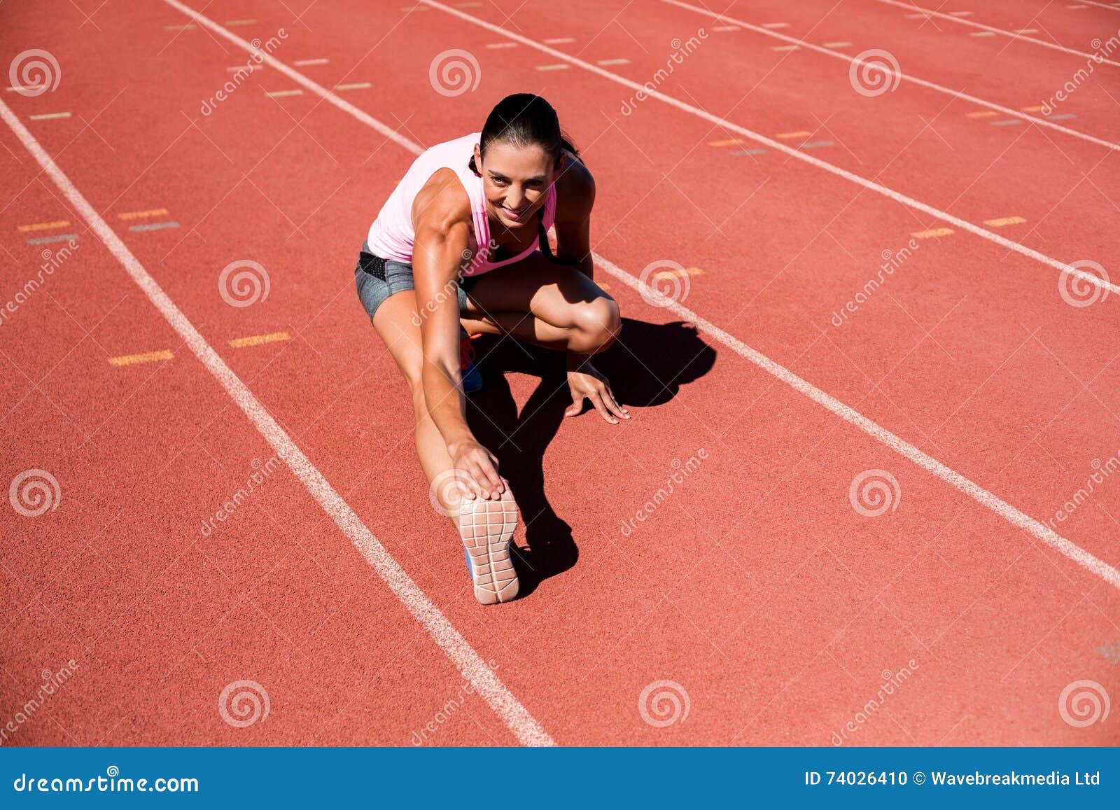 Portrait of Female Athlete Stretching Her Hamstring Stock Photo - Image ...