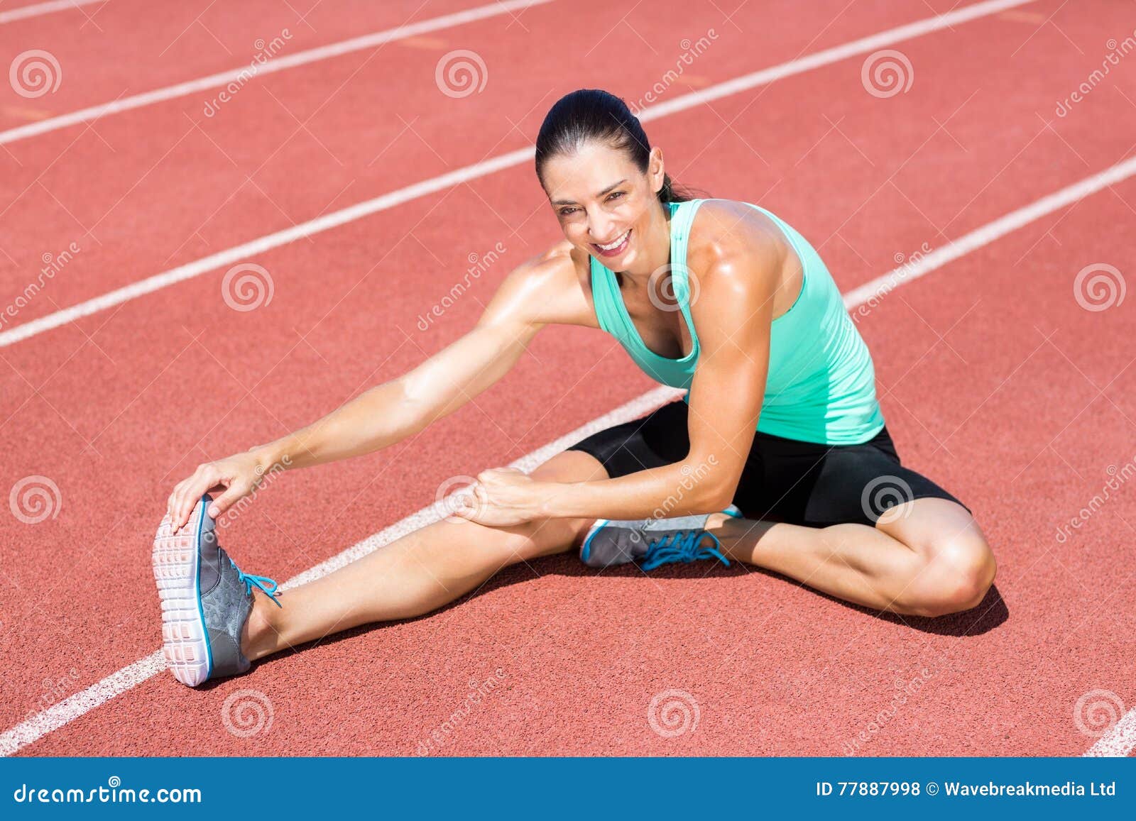 Portrait of Female Athlete Stretching Her Hamstring Stock Photo - Image ...