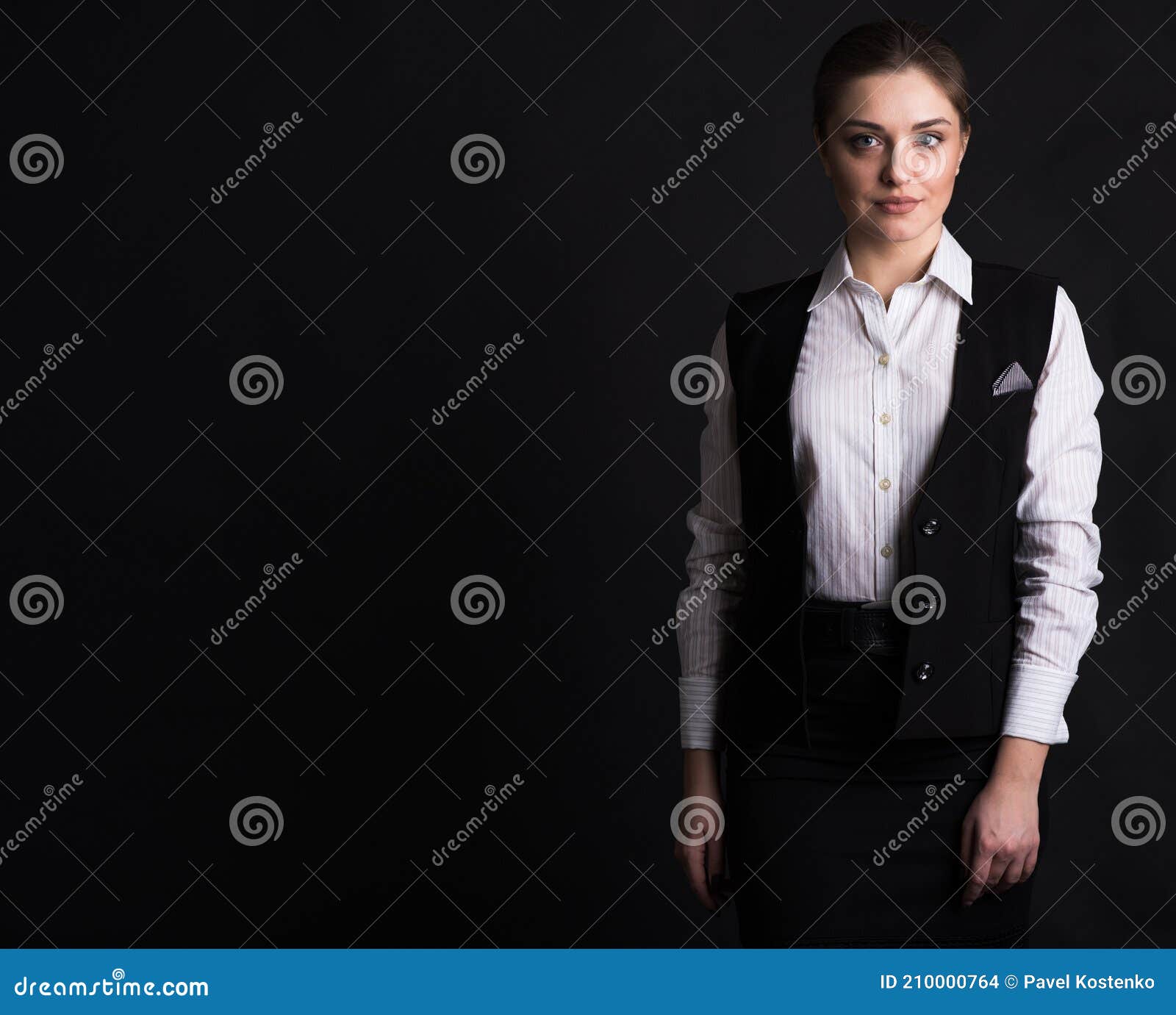 Portrait of a Female Business Lady in the Studio on a Black Background ...