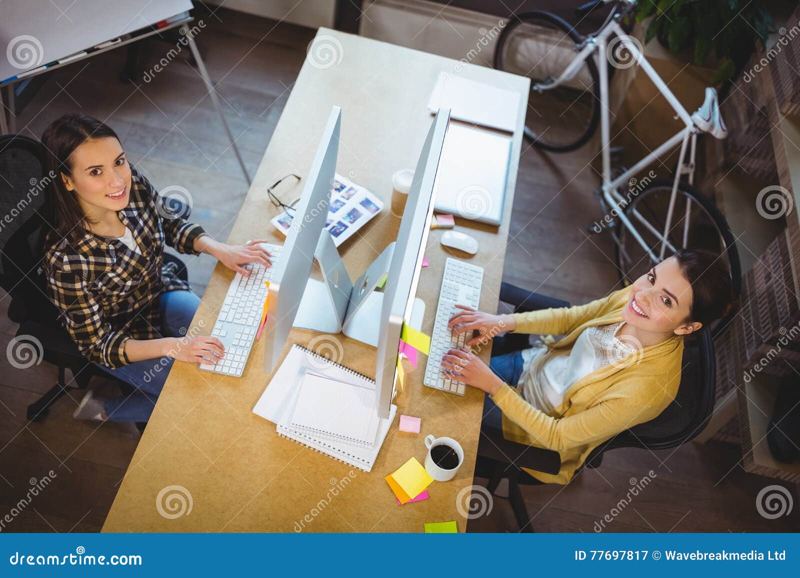Portrait of Female Colleagues Working at Computer Desk Stock Image ...