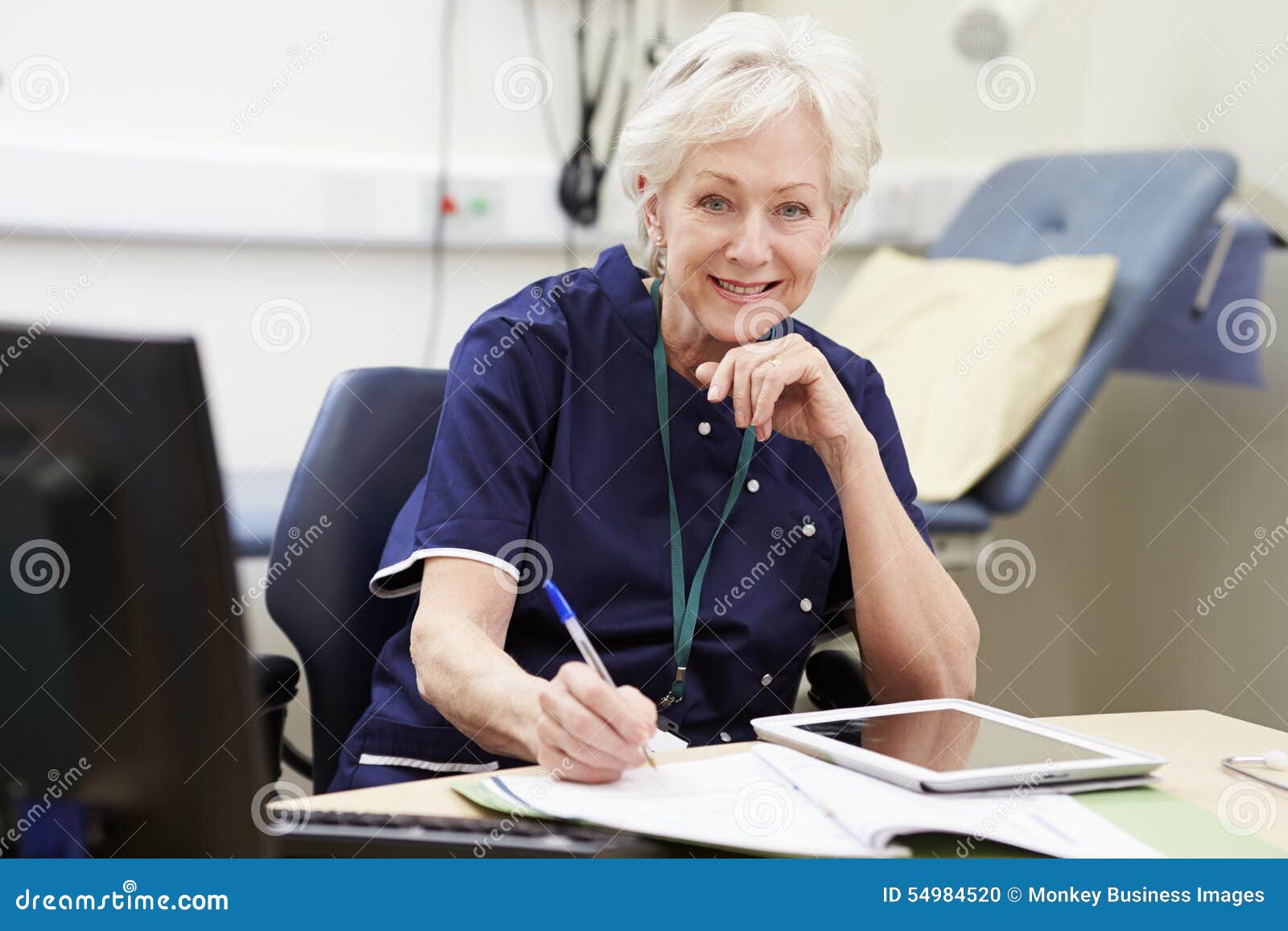 Portrait of Female Consultant Working at Desk in Office Stock Photo ...