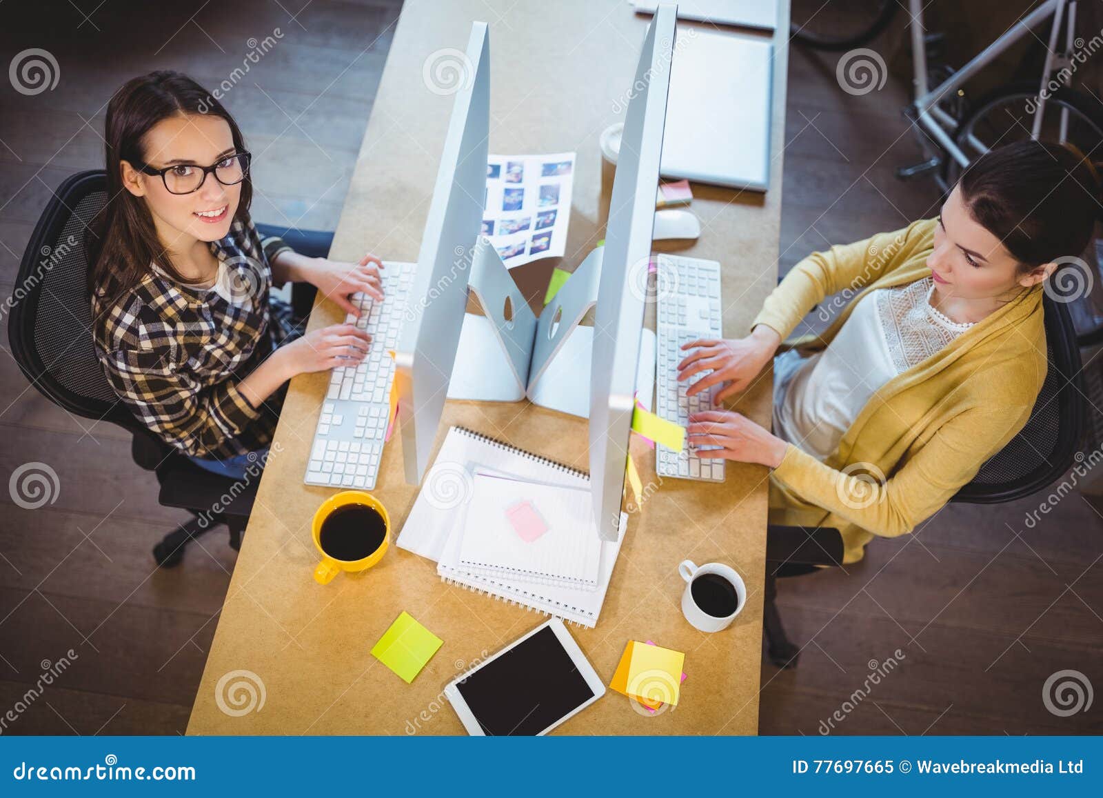 Portrait of Female Coworkers Working at Computer Desk Stock Image ...