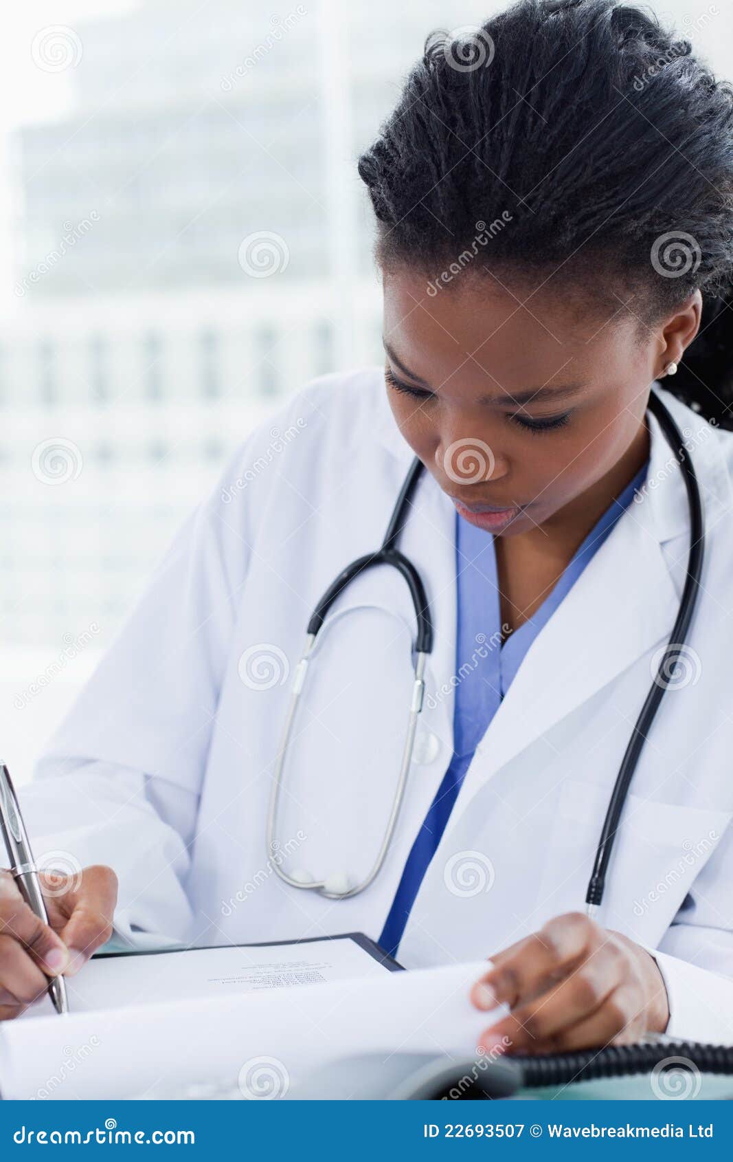 Portrait of a Female Doctor Signing a Document Stock Image - Image of ...