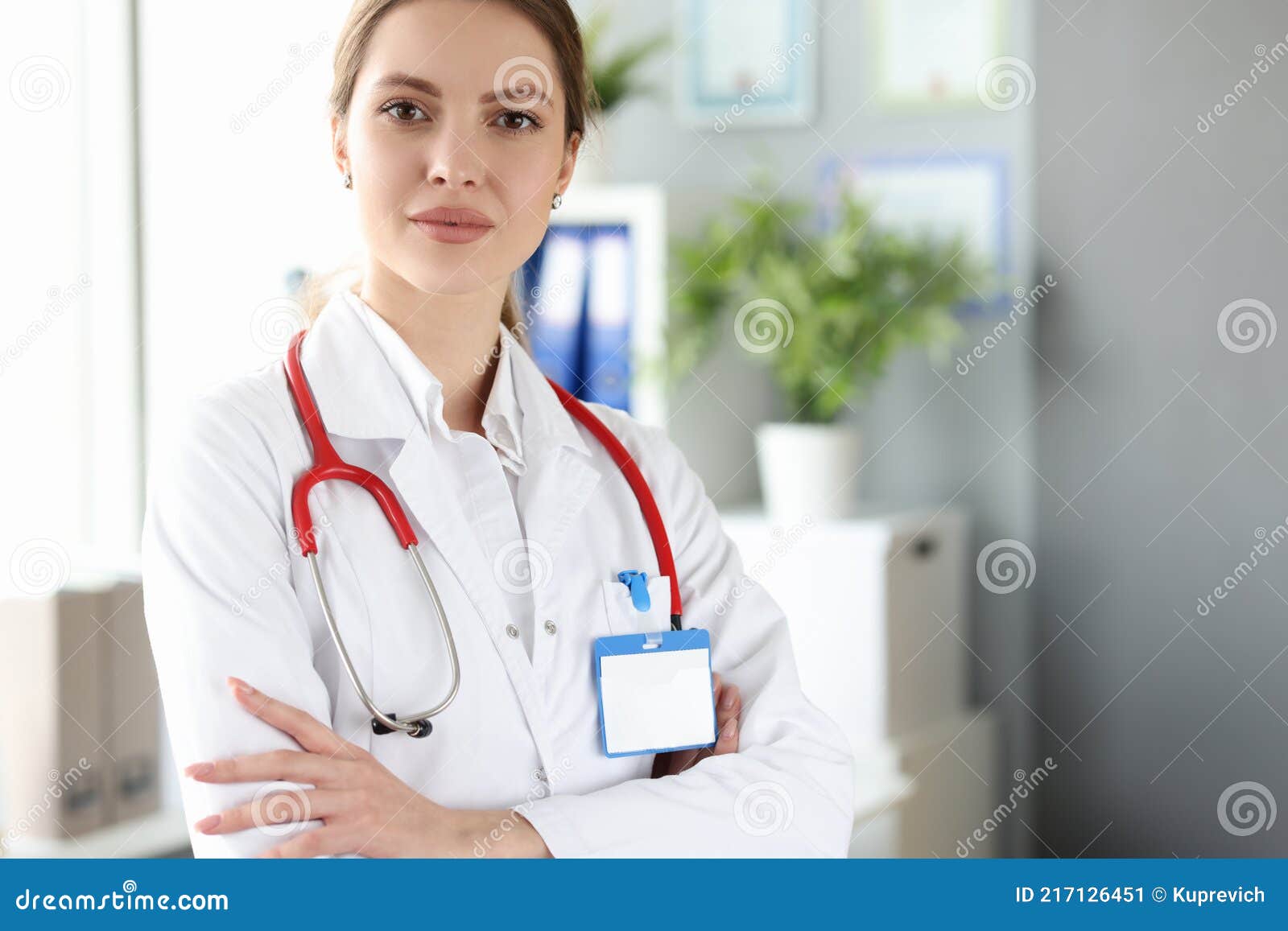 Portrait Of Female Doctor In White Coat In Medical Office Stock Image