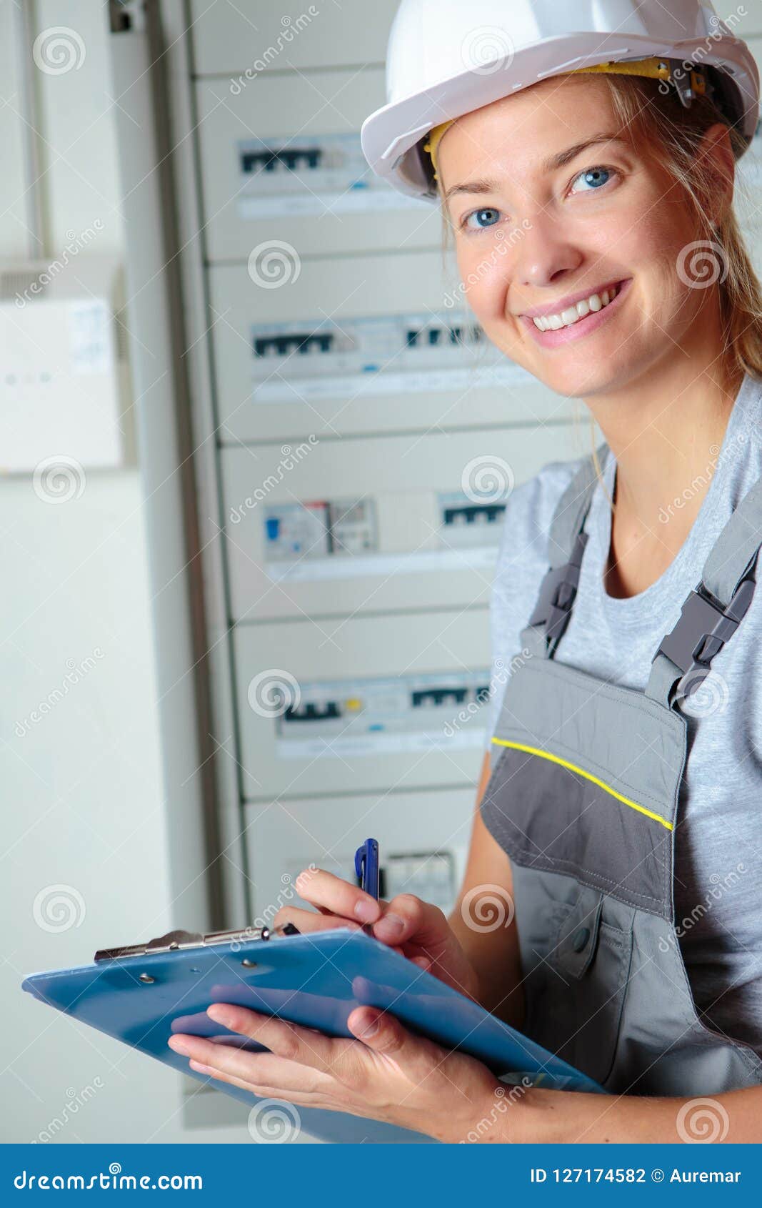 Portrait of Female Electrician Stock Photo - Image of writing ...