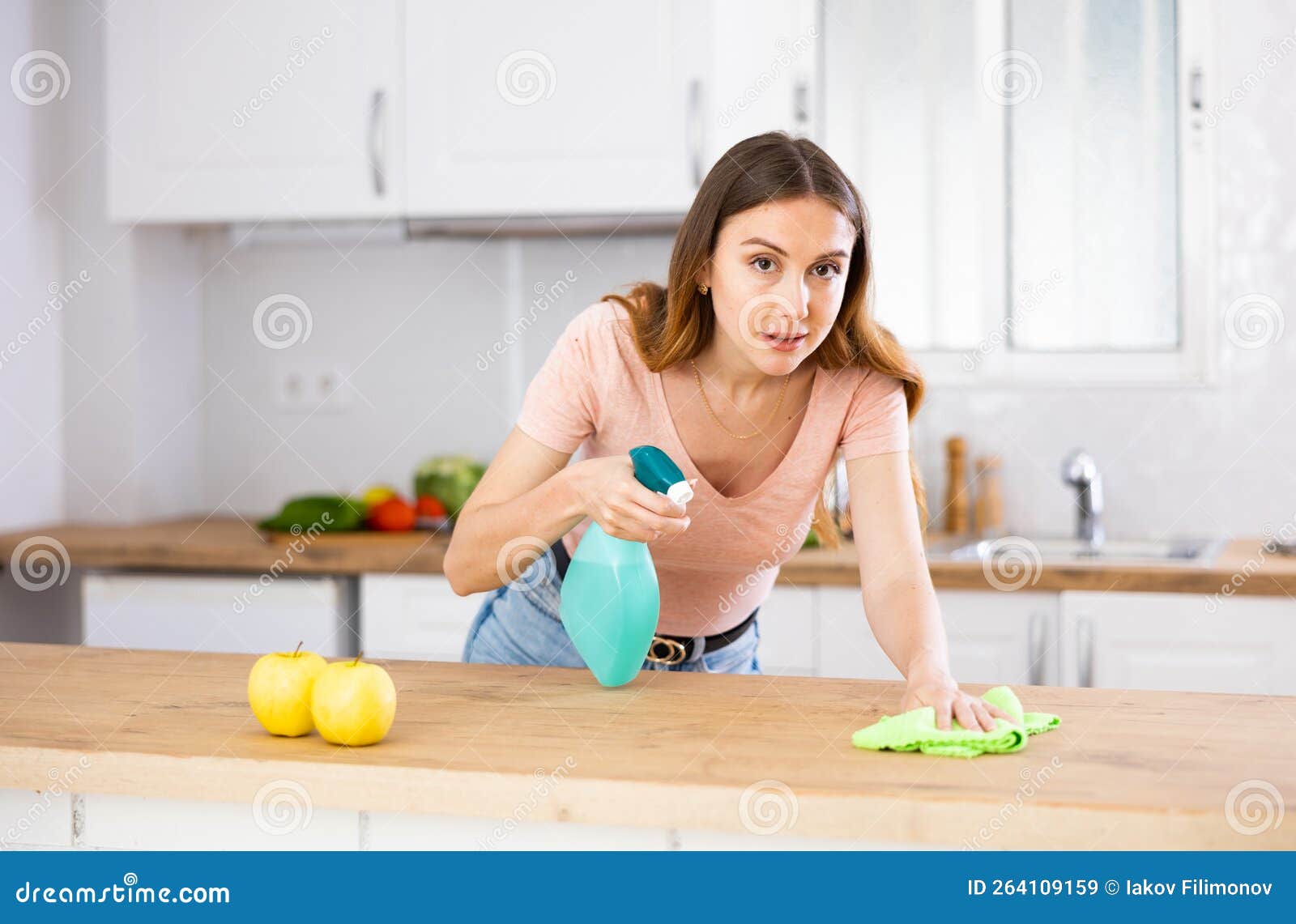 Portrait of Female Houseworker Dusting Kitchen Surfaces Stock Image ...