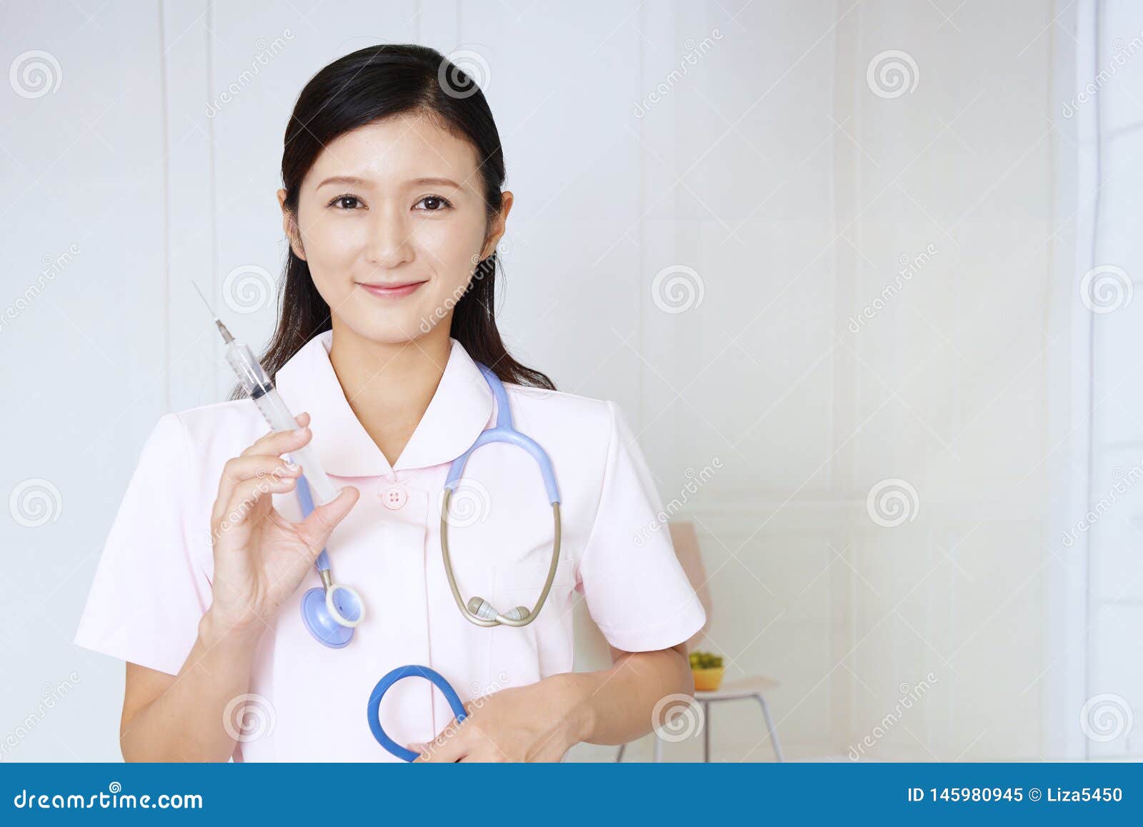 Smiling female nurse stock image. Image of enjoying - 145980945