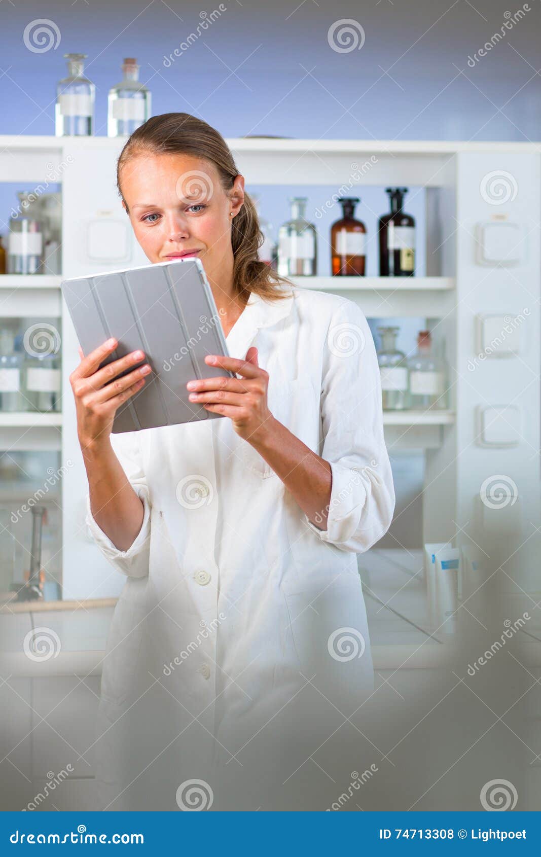 Portrait of a Female Researcher Doing Research in a Lab, Using a Stock ...