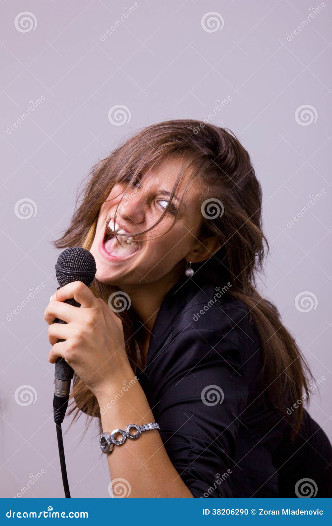 Portrait of Female Singer Holding Microphone Stock Photo - Image of ...