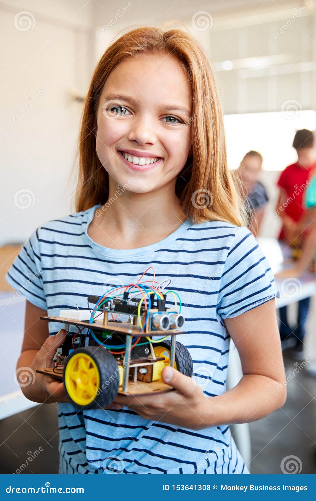 Portrait of Female Student Building Robot Vehicle in after School ...