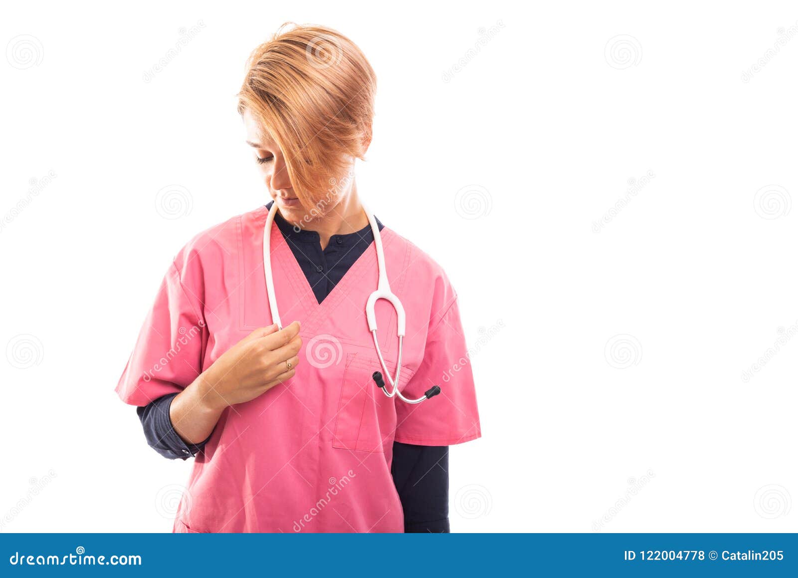 Portrait of Female Vet Wearing Pink Scrub Looking at Stethoscope Stock ... Portrait of Female Vet Wearing Pink Scrub Looking at Stethoscope Stock ...