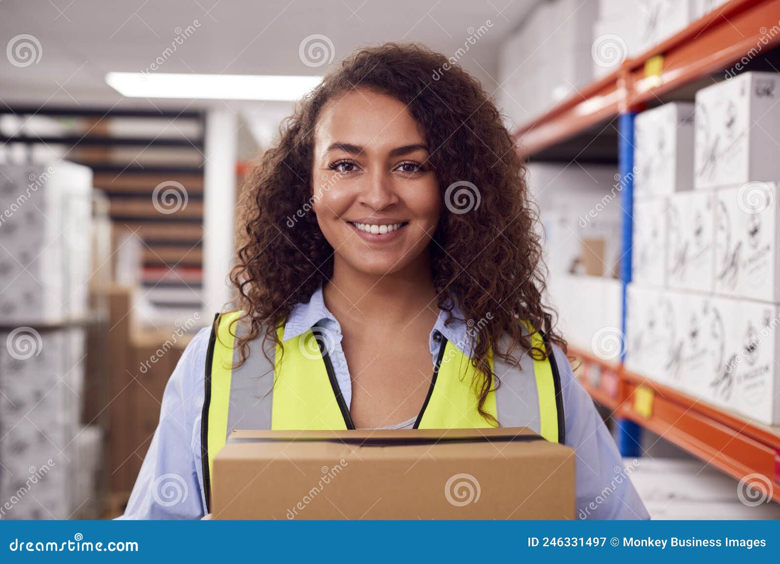 Portrait of Female Worker Holding Box Inside Warehouse Stock Image ...