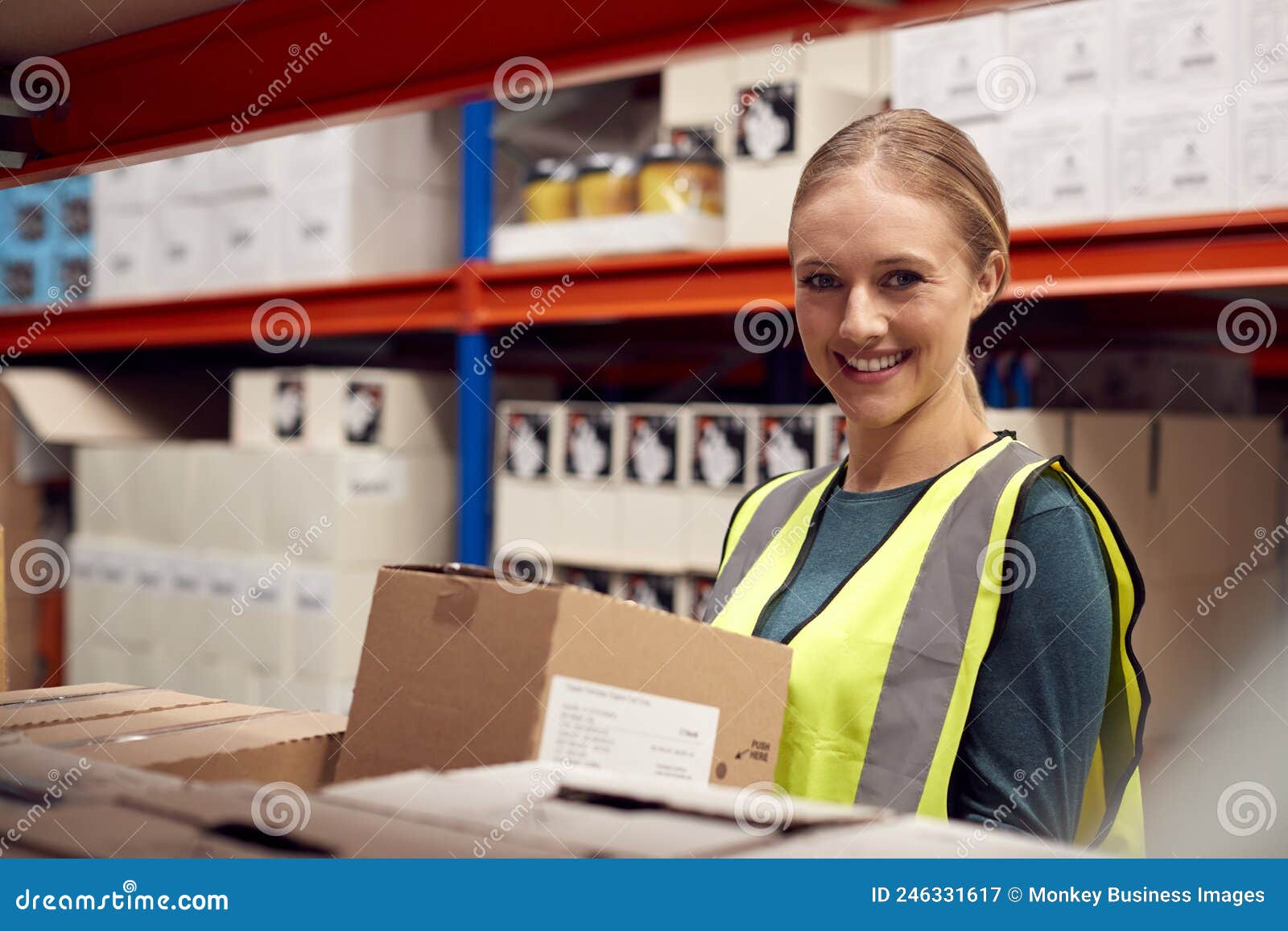 Portrait of Female Worker Picking Box from Shelf Inside Warehouse Stock ...
