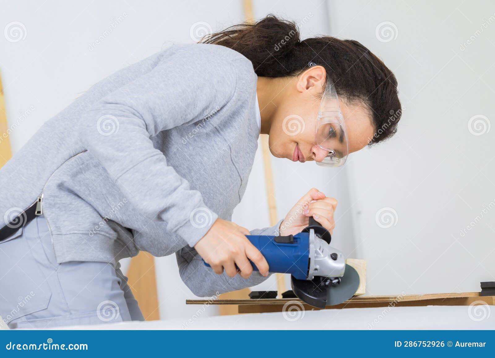 Portrait Female Worker Using Grinder Stock Photo - Image of electricity ...