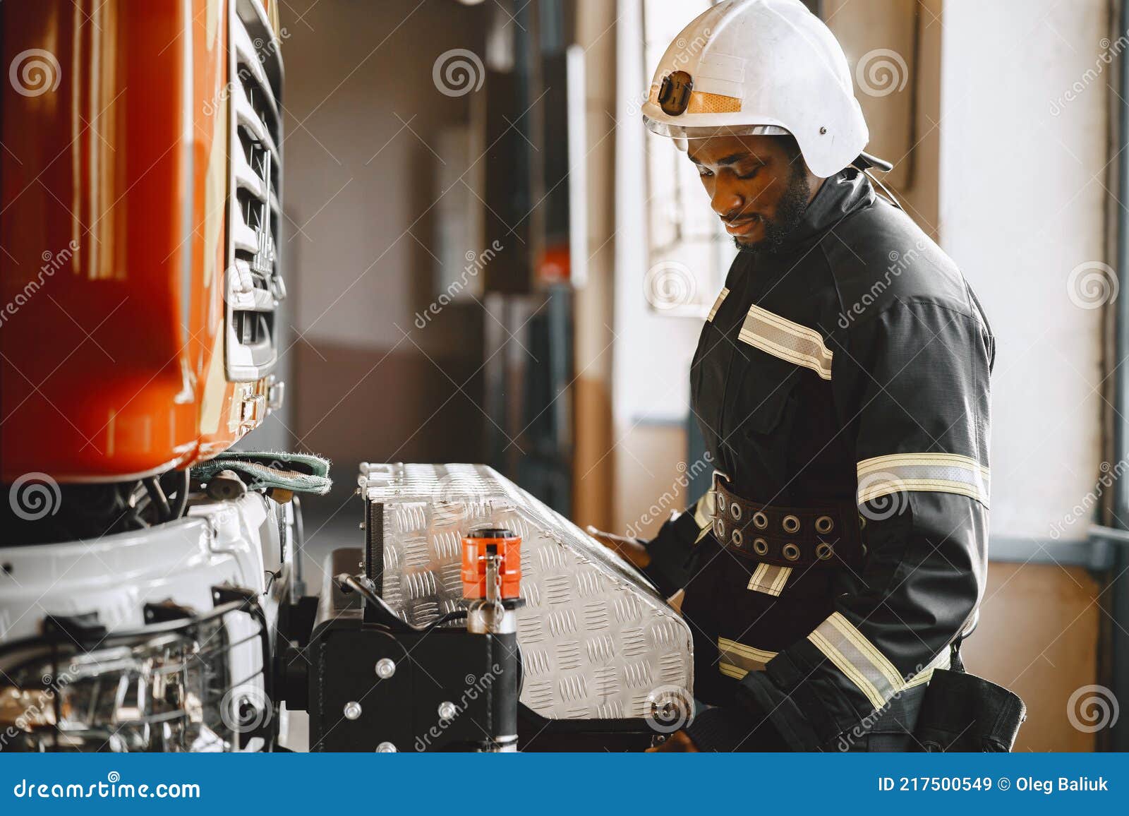 Portrait of a Firefighter Standing in Front of a Fire Engine Stock ...