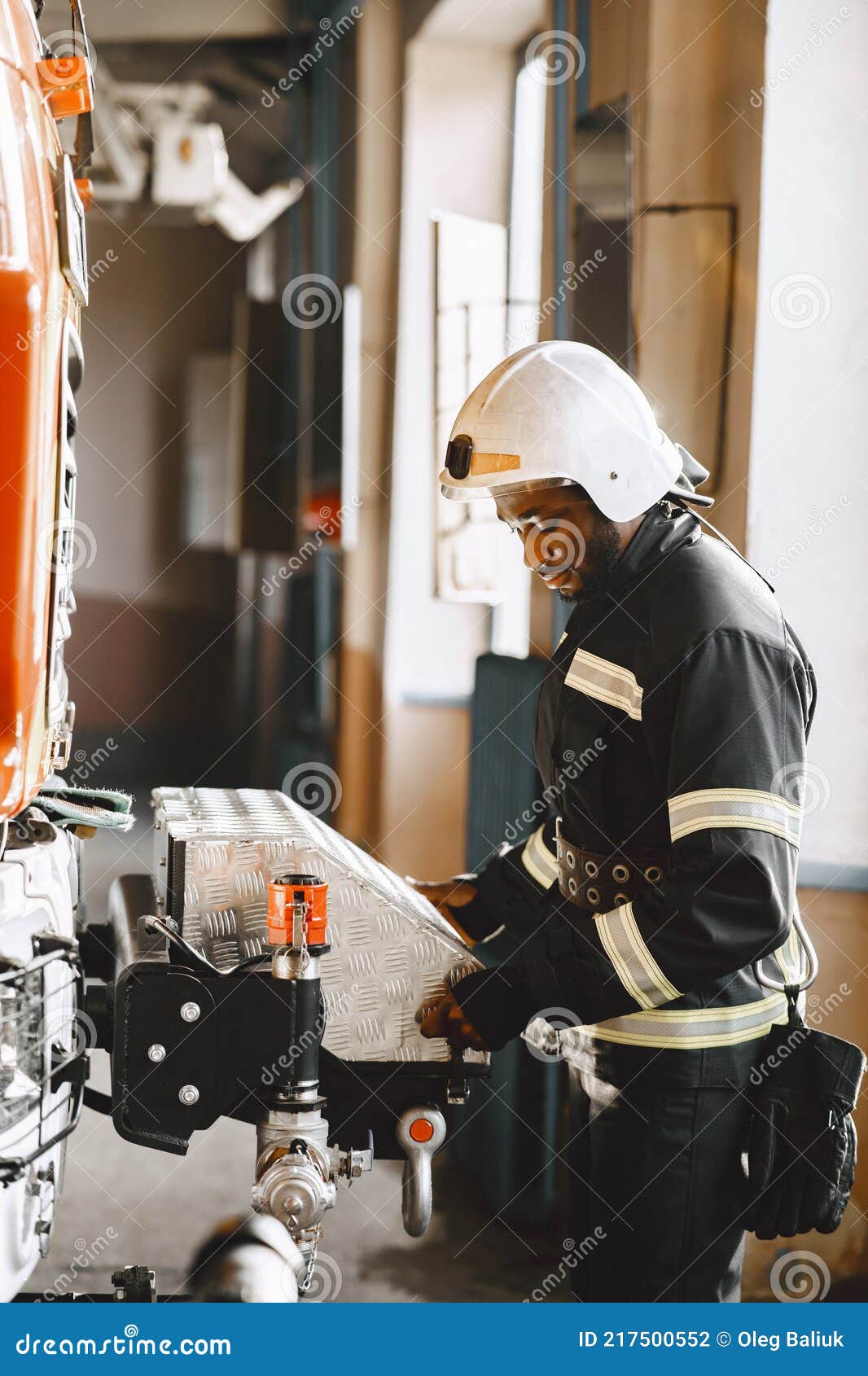 Portrait of a Firefighter Standing in Front of a Fire Engine Stock ...