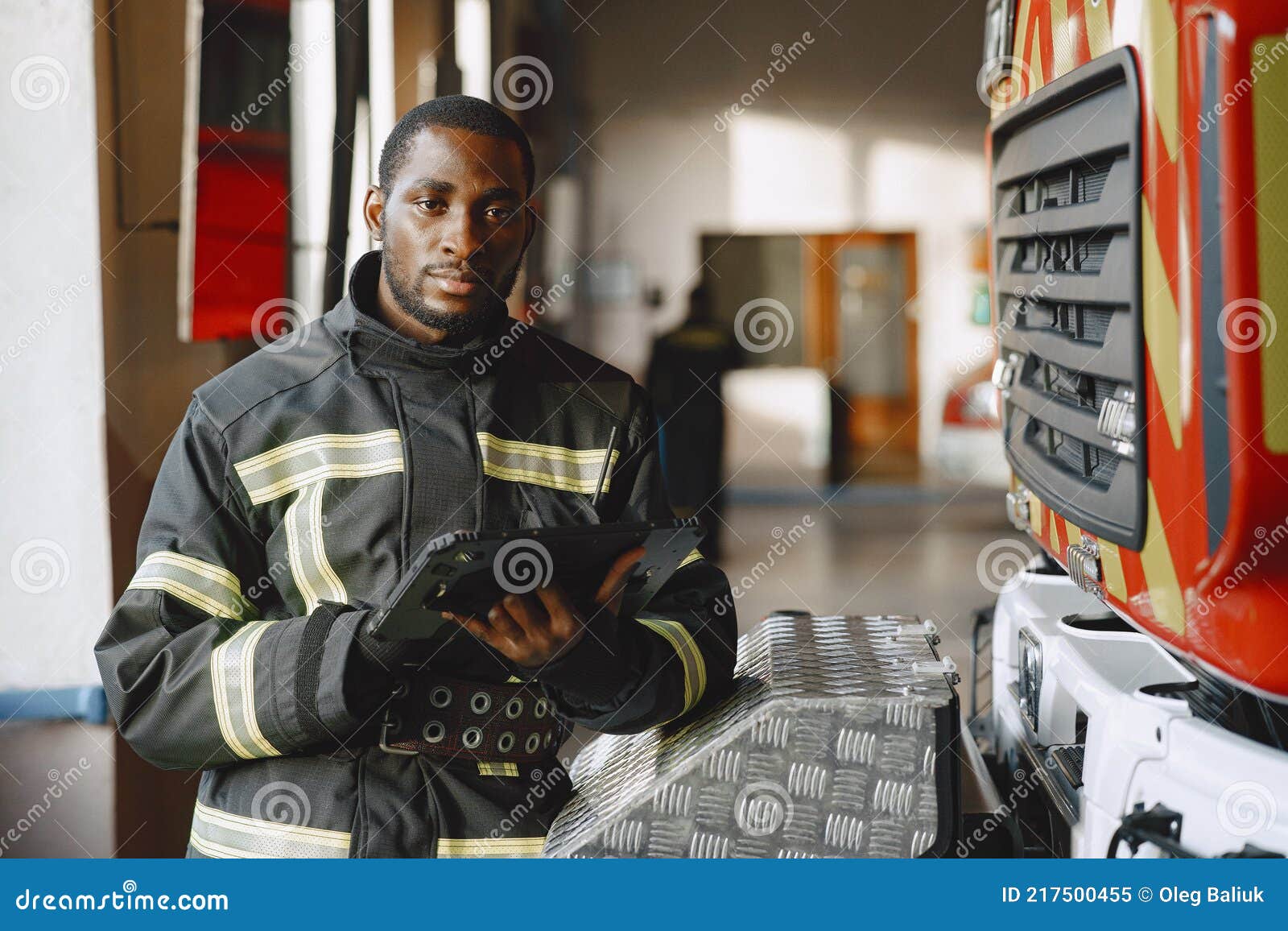 Portrait of a Firefighter Standing in Front of a Fire Engine Stock ...