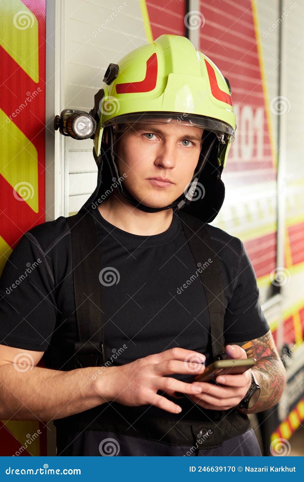 Portrait of a Firefighter Standing in Front of a Fire Engine. Fireman ...