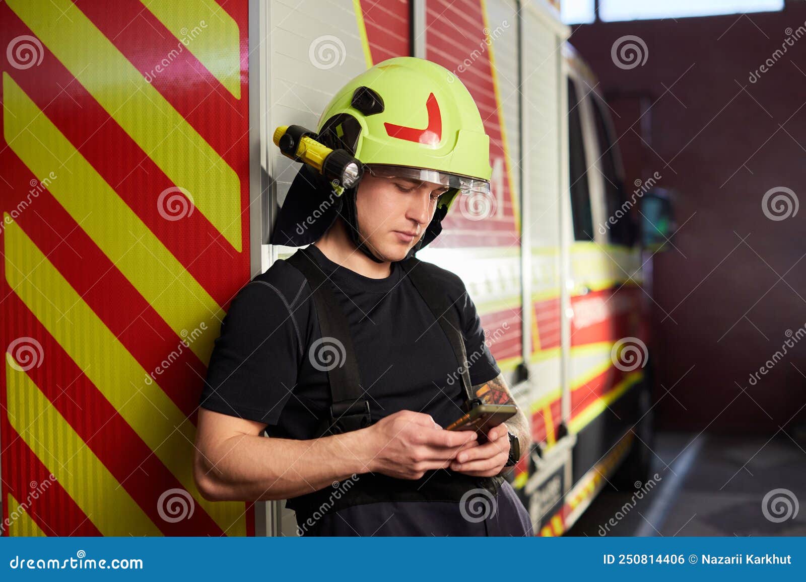 Portrait of a Firefighter Standing in Front of a Fire Engine. Fireman ...