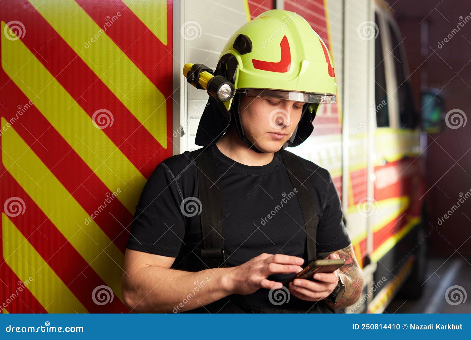Portrait of a Firefighter Standing in Front of a Fire Engine. Fireman ...