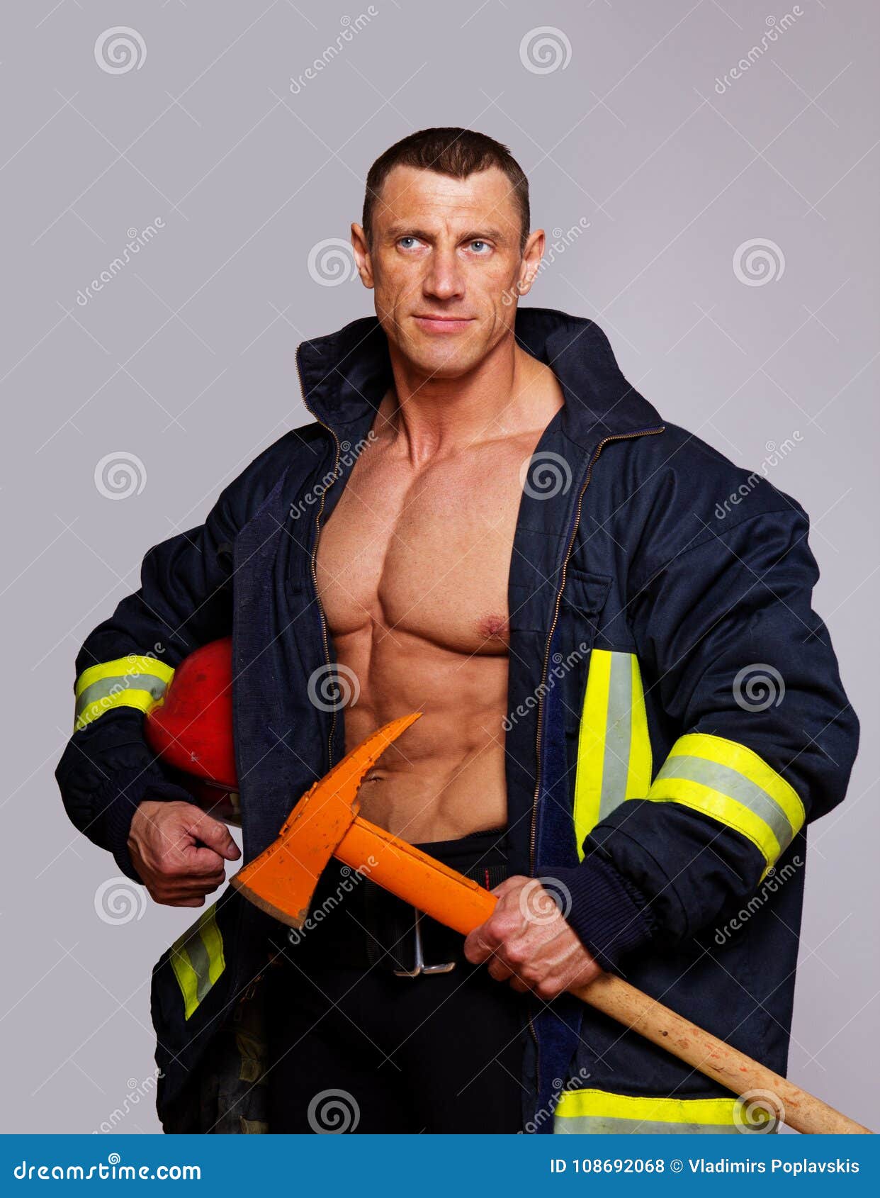Portrait of Fireman Posing on Grey Background Stock Photo - Image of ...
