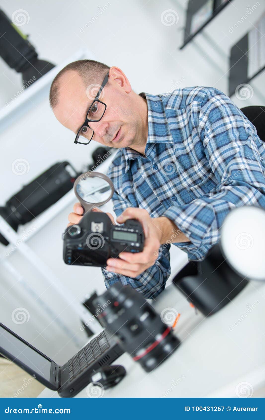Portrait Focused Man Fixing Camera at Workplace Stock Image - Image of ...