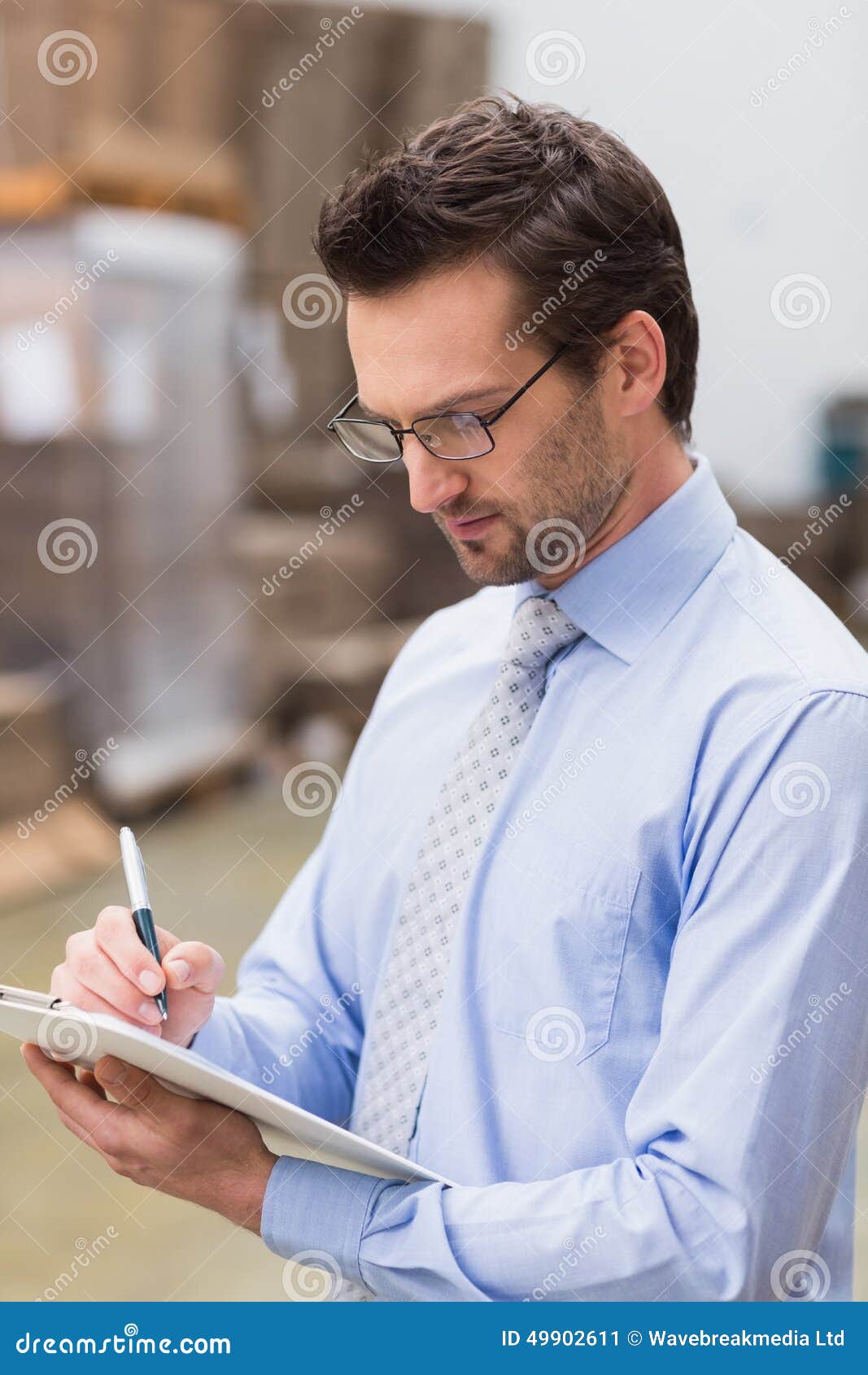 Portrait of Focused Manager Writing on His Clipboard Stock Image ...
