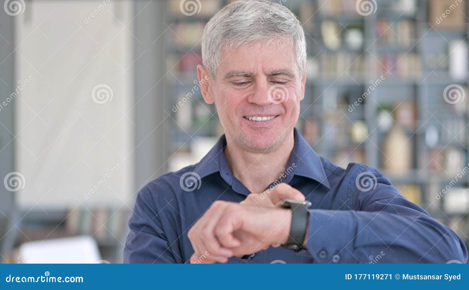 Portrait of Focused Middle Aged Man Using Smart Watch Stock Image ...